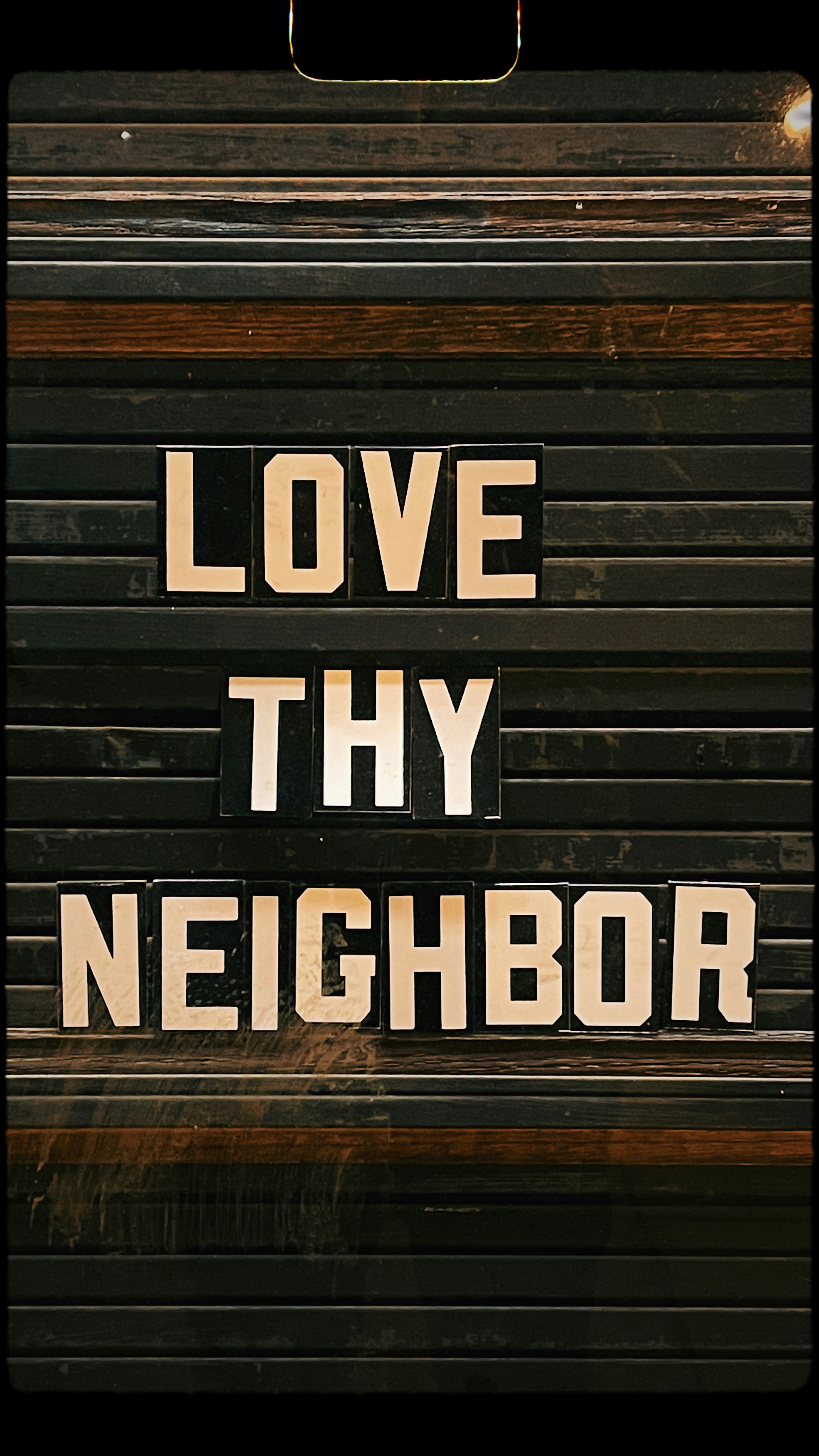 A suitcase with the words love thy neighbor written on it photo – Free ...
