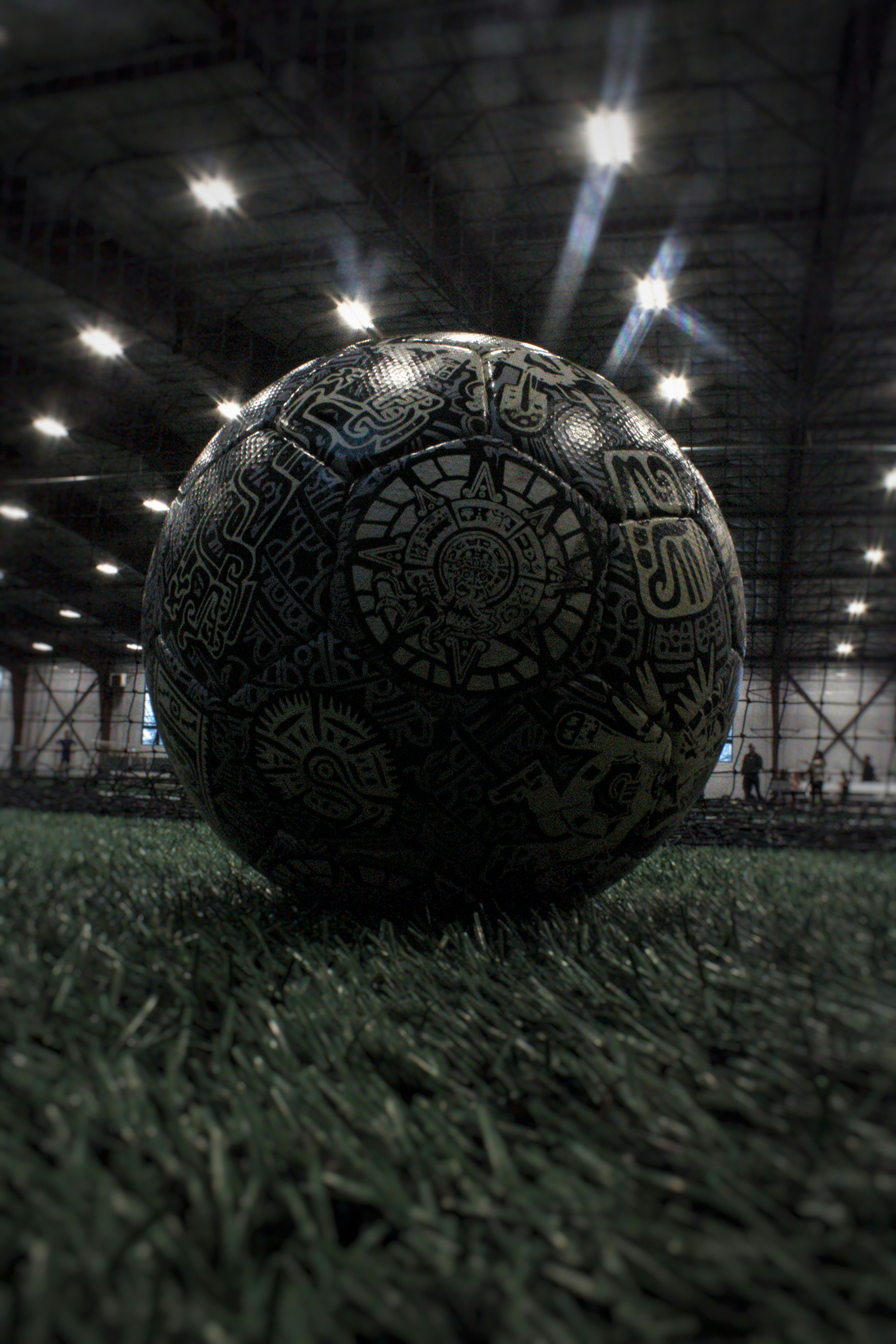 A large ball sitting on top of a lush green field photo – Free Black ...