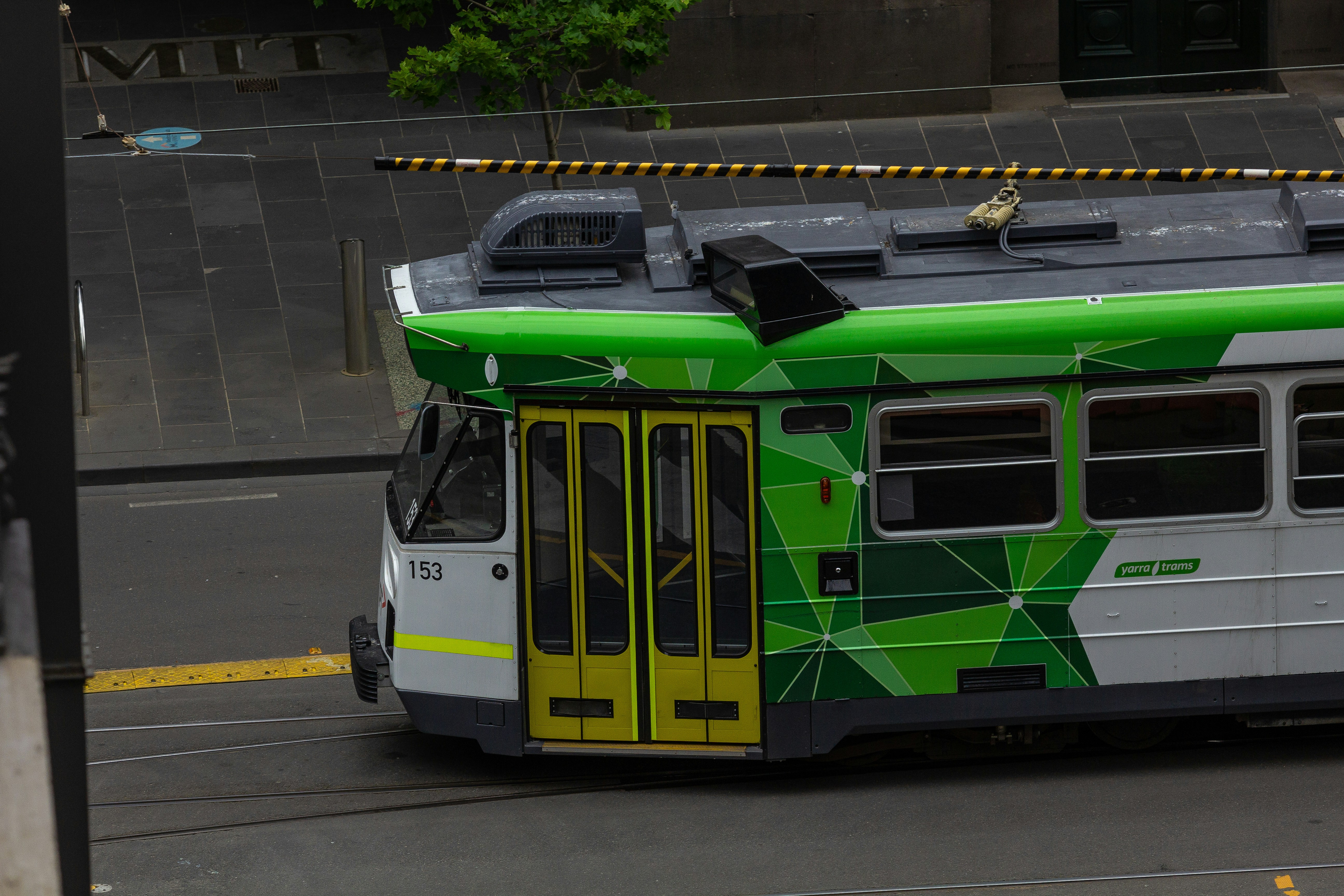 Geometric Green Streetcar on a Quiet City Street