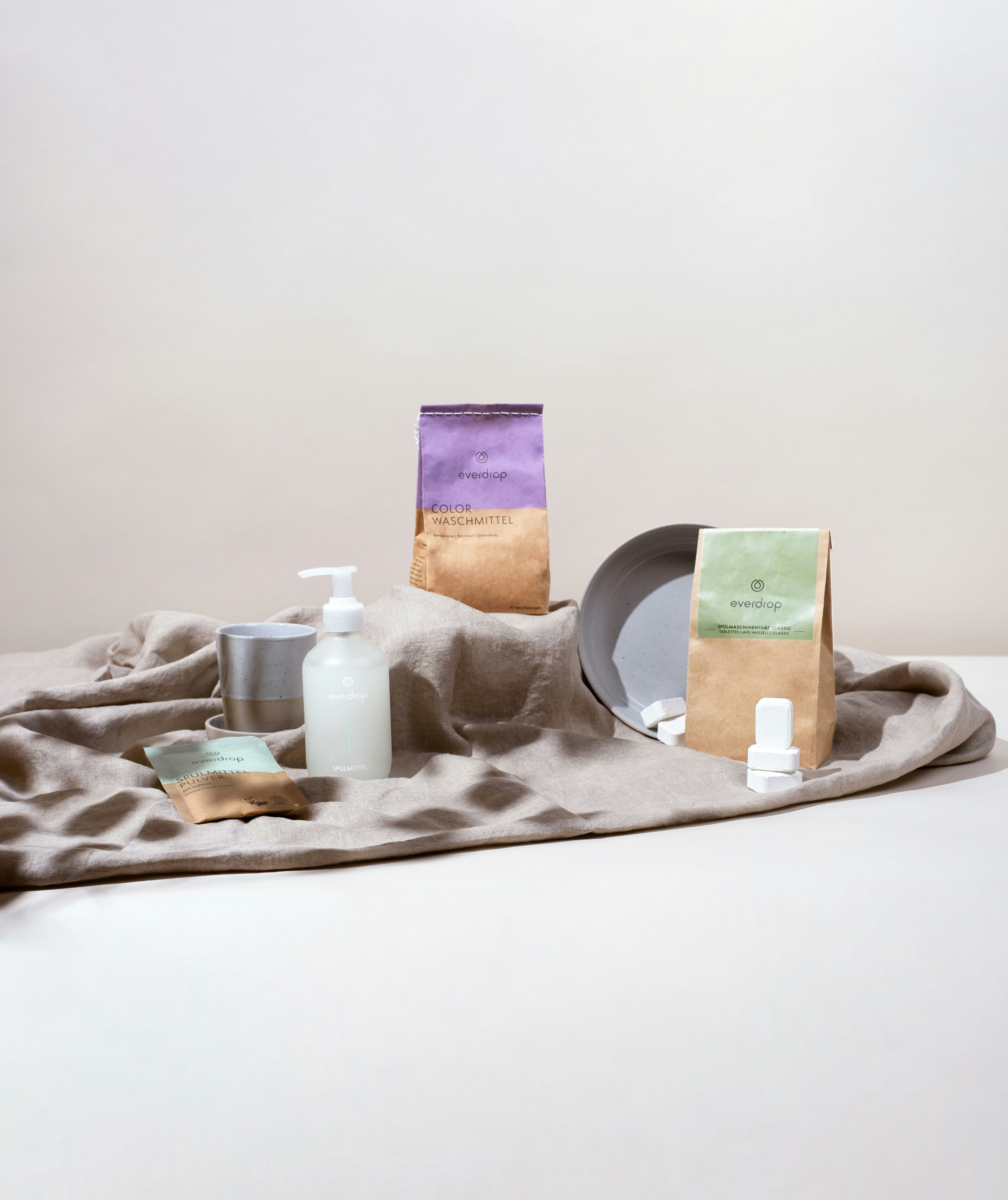 A table topped with a plate and bottles of lotion photo – Free Set ...