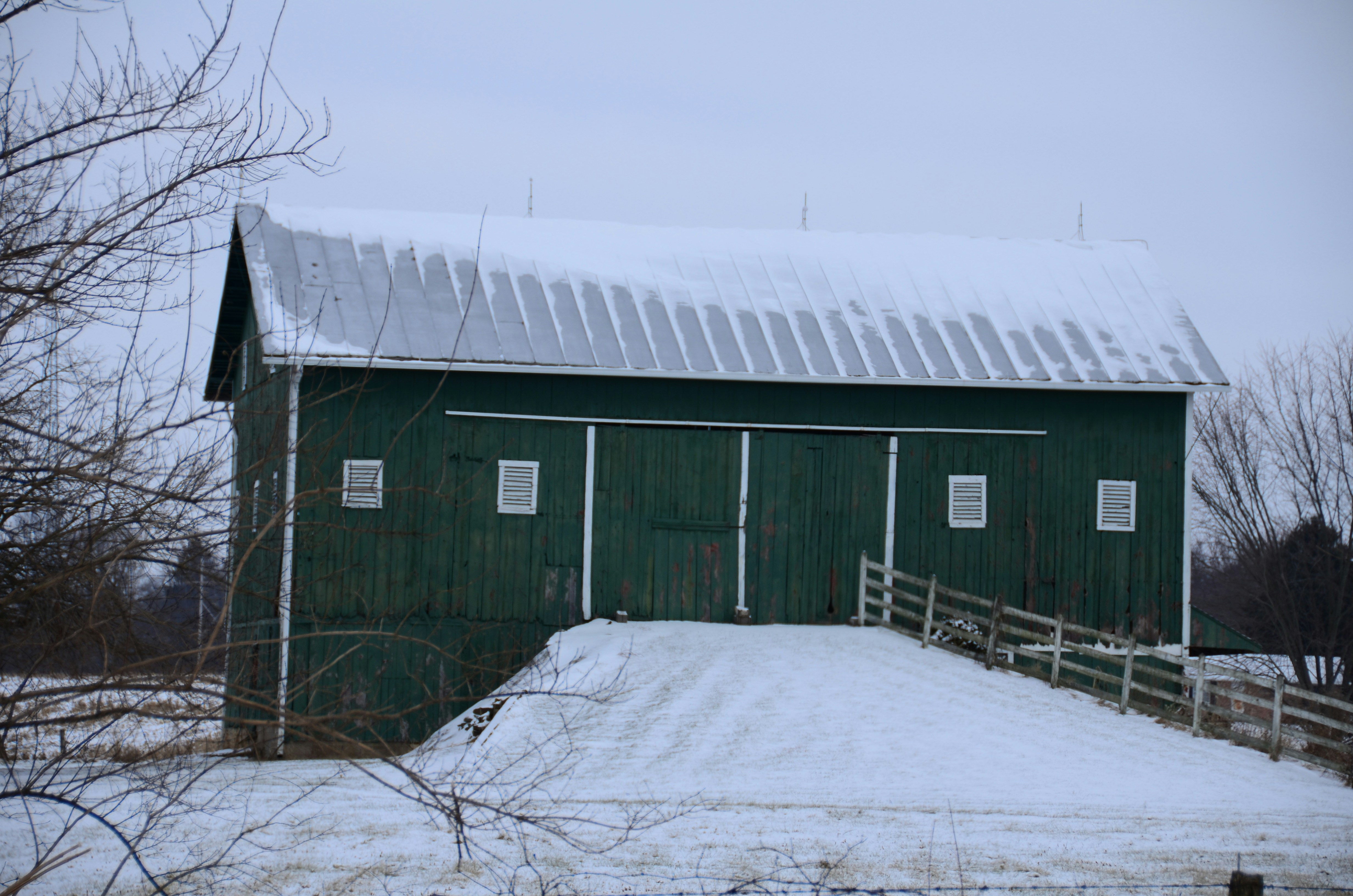 Green Barn on a Snow-Swept Slope, Quiet Winter Light