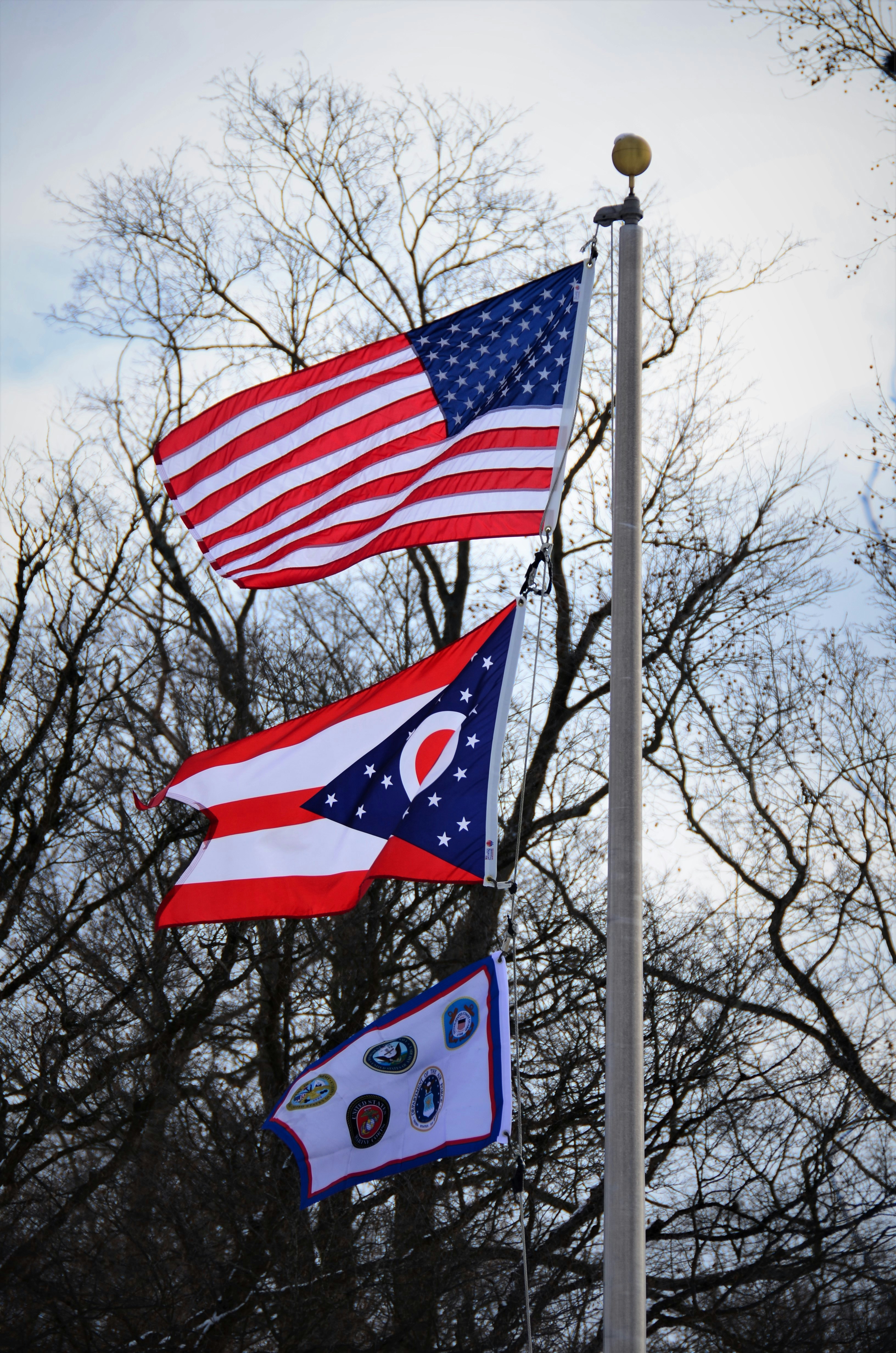 Three american flags are flying in the wind photo – Free Flag Image on ...