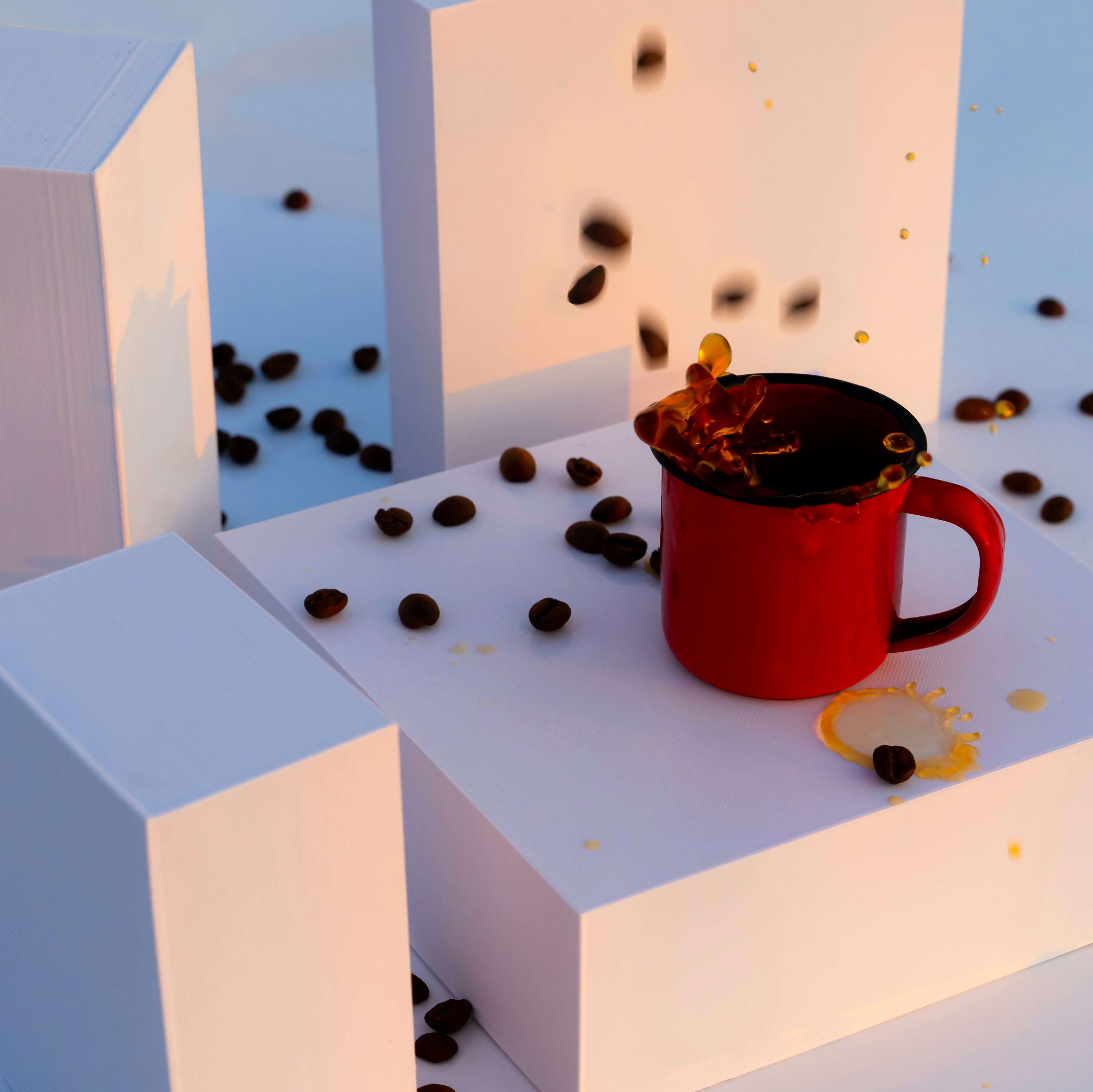 A Red Mug Sparks Coffee Fling Across White Geometric Stacks