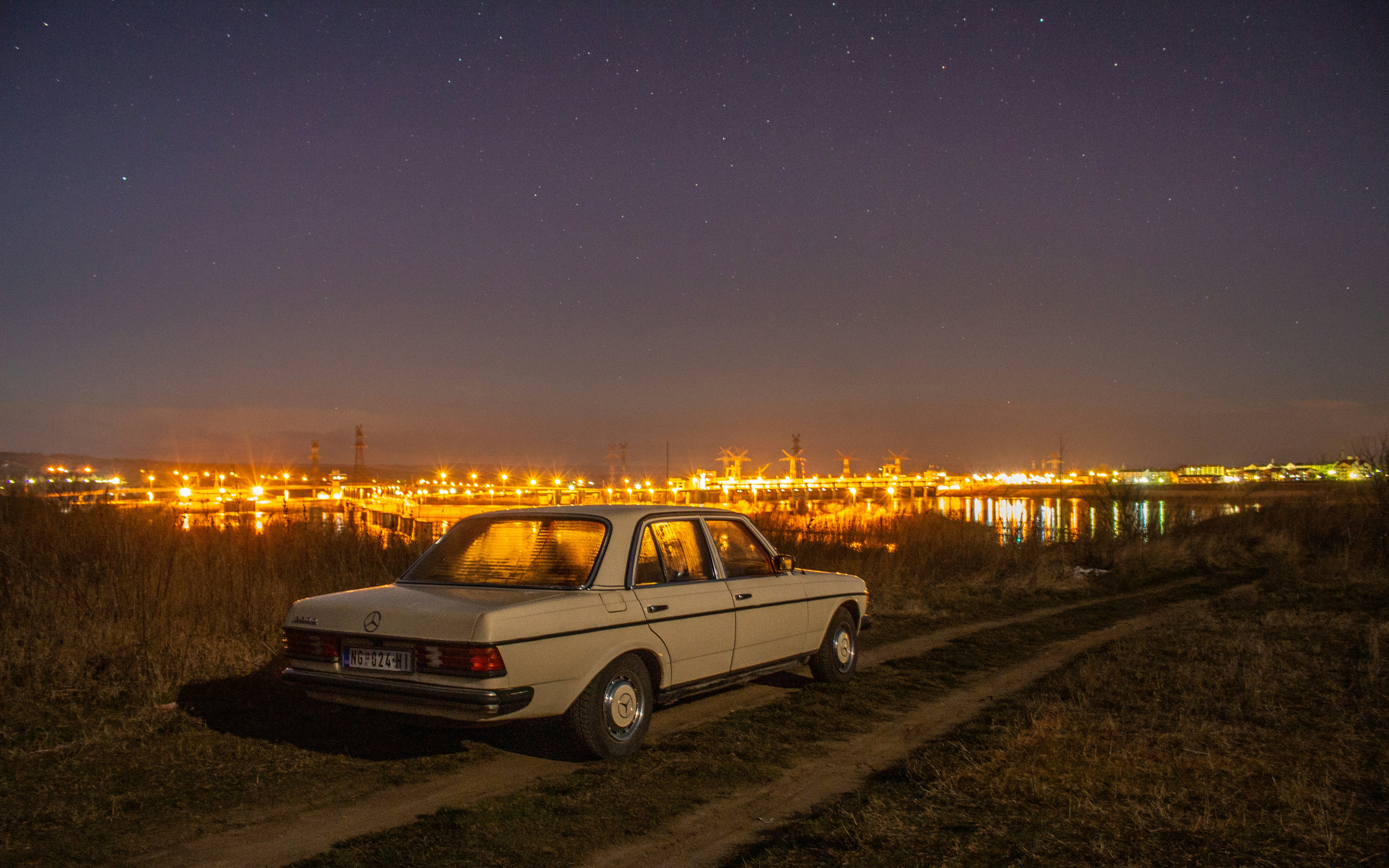 Night Run by the Riverside: A Quiet Car Under City Lights
