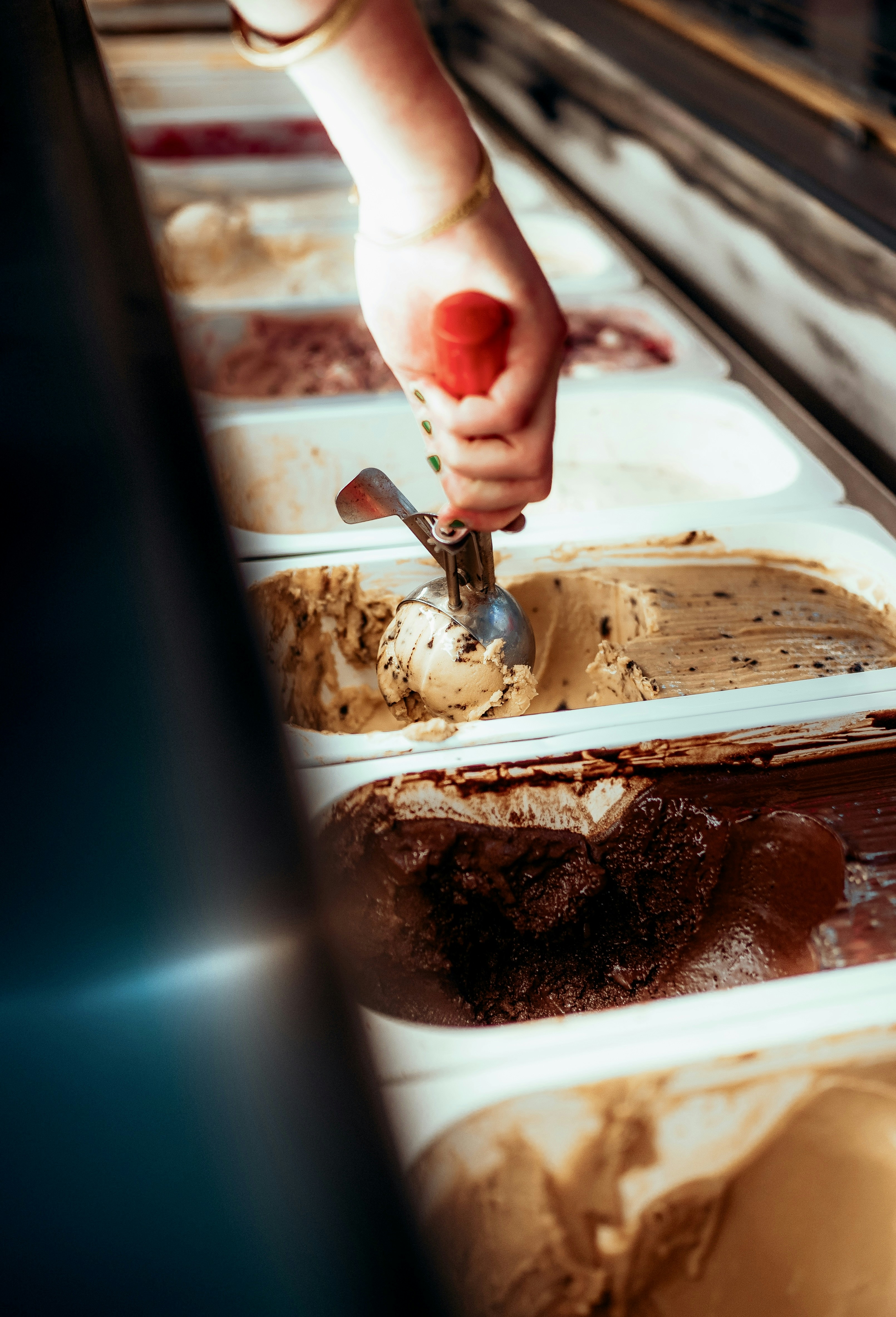 Person Scooping Ice Cream