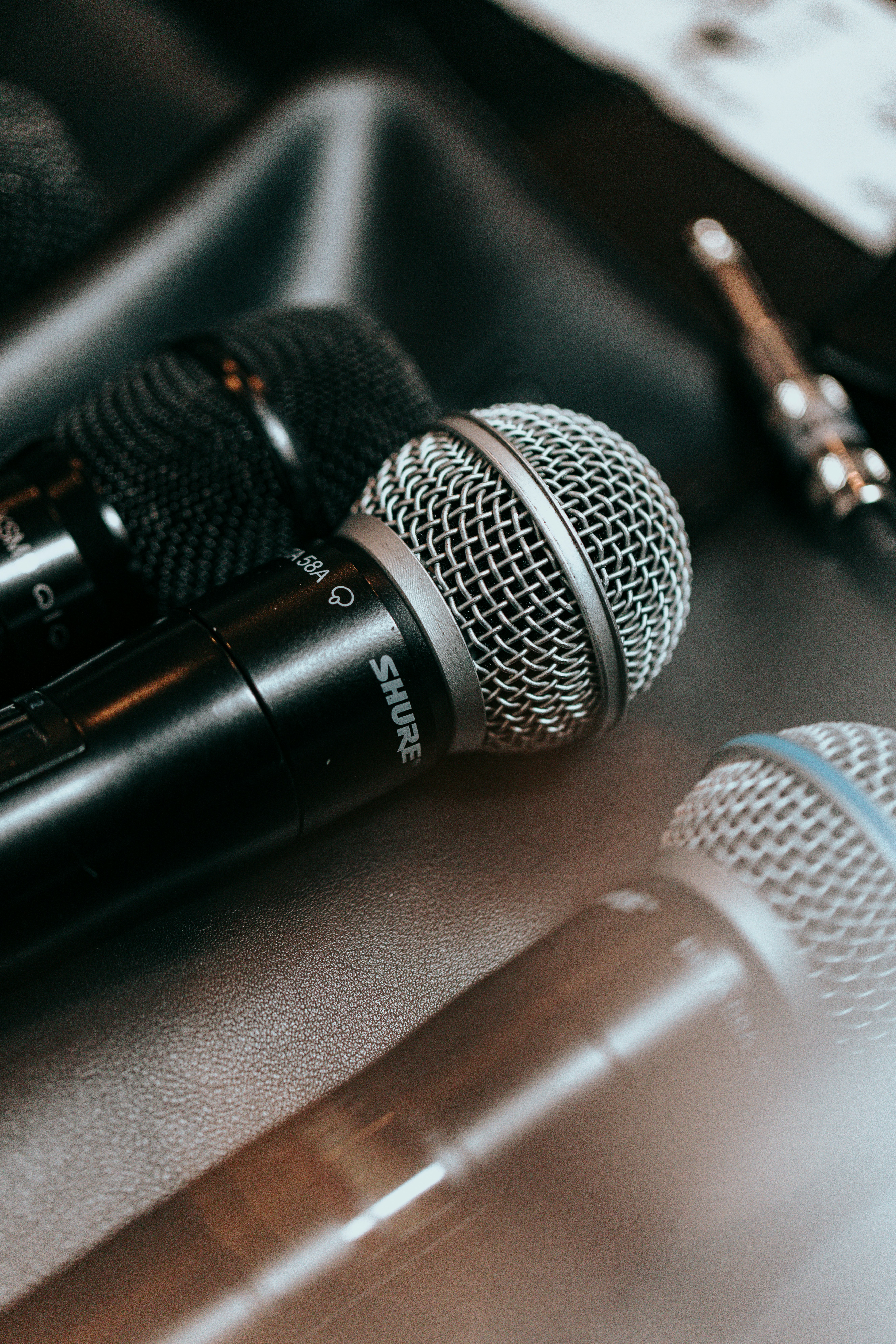 A close up of two microphones on a table photo – Free Grey Image on ...