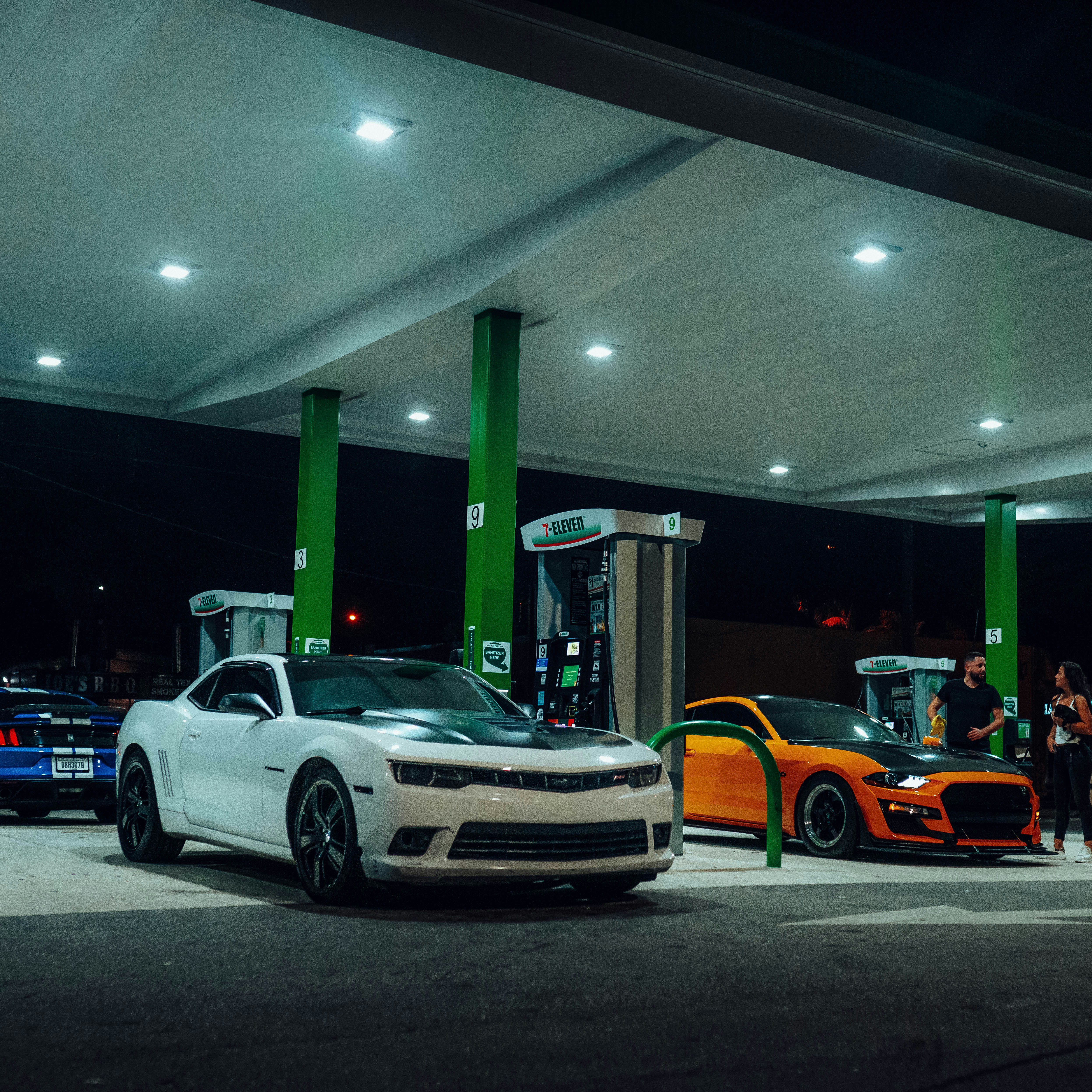 A couple of cars are parked at a gas station photo – Free Miami Image ...