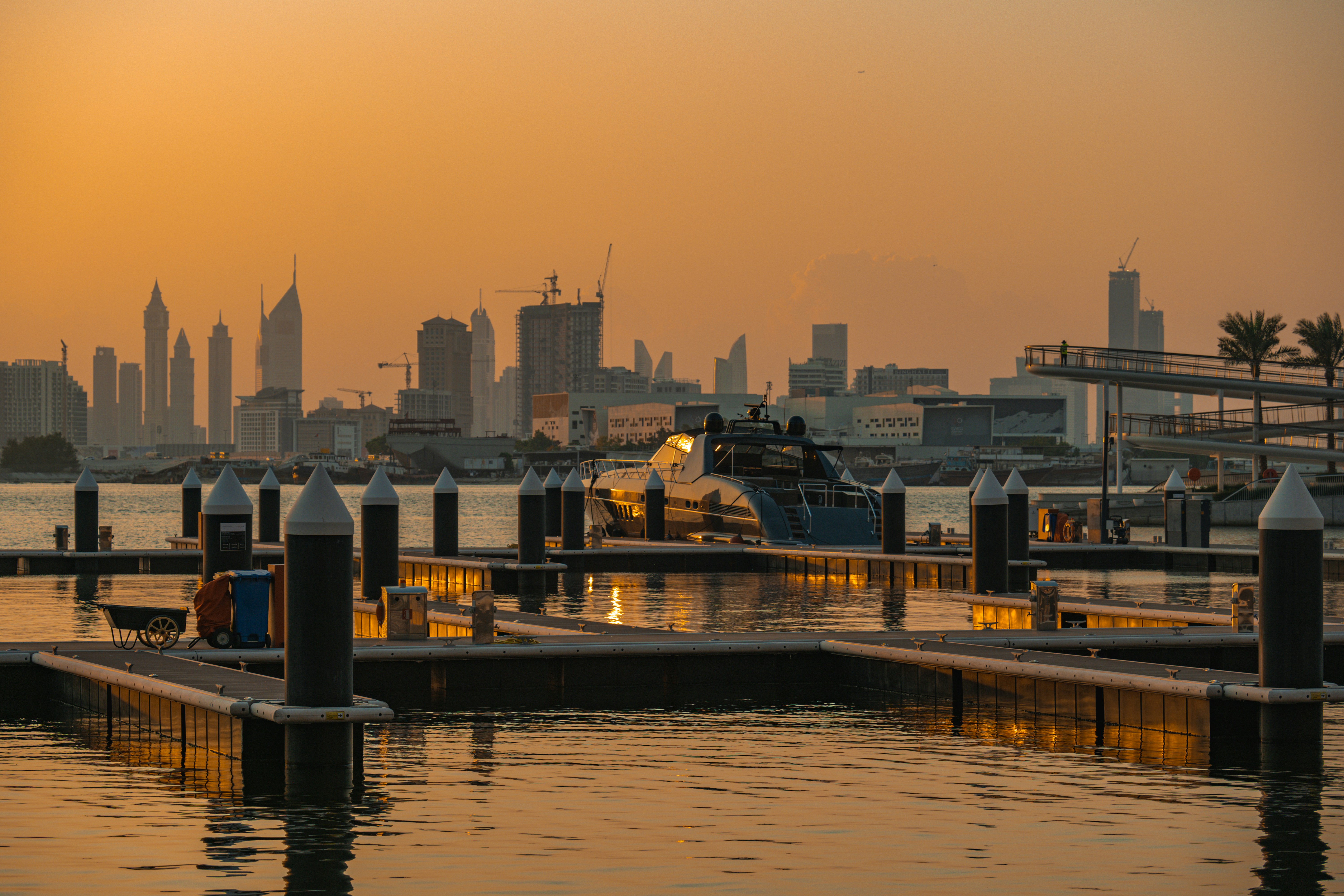 Golden Hour at the Marina: City Silhouette Beyond the Docks
