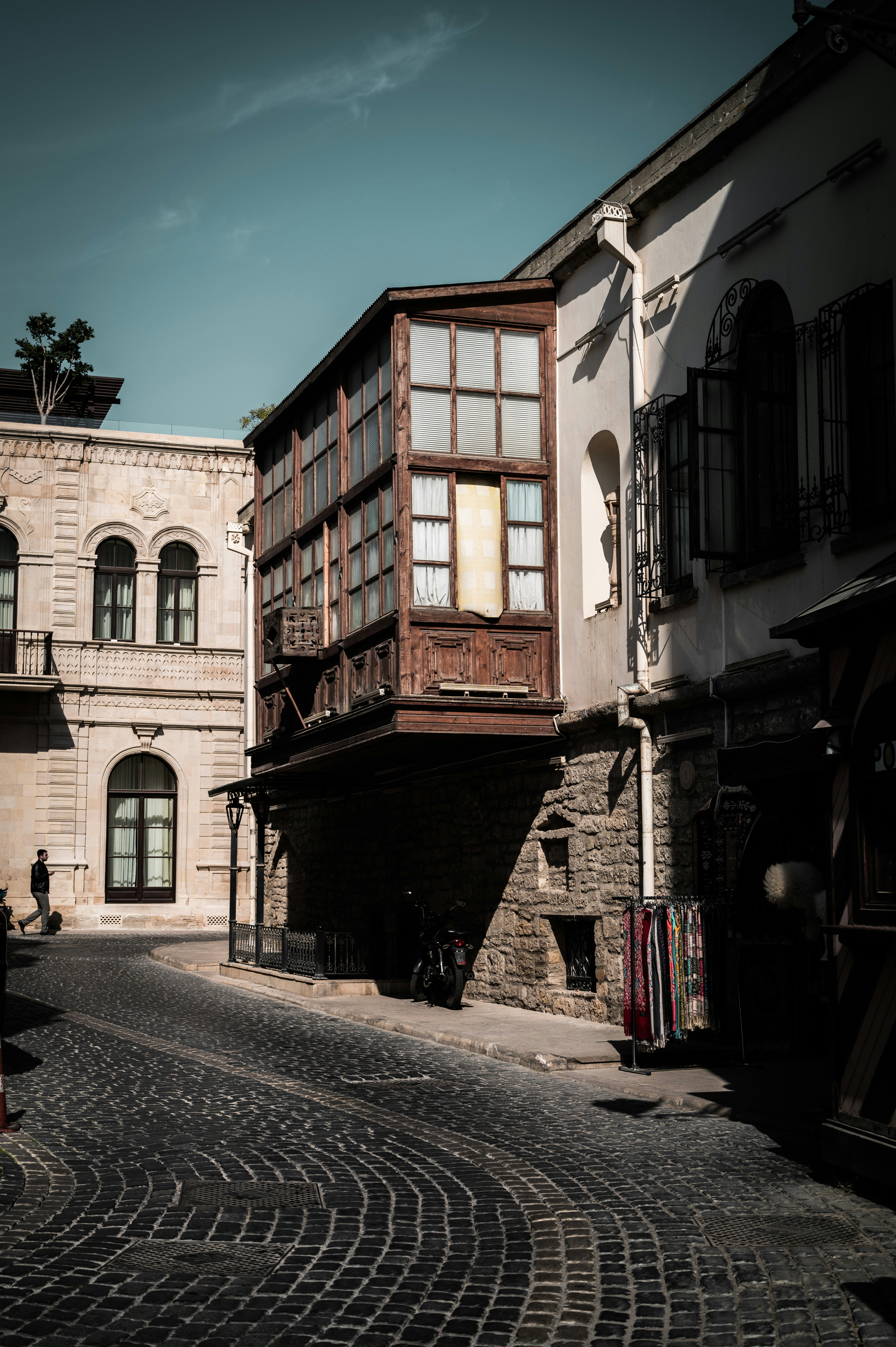Timbered Balcony Overlook on a Cobblestone Street