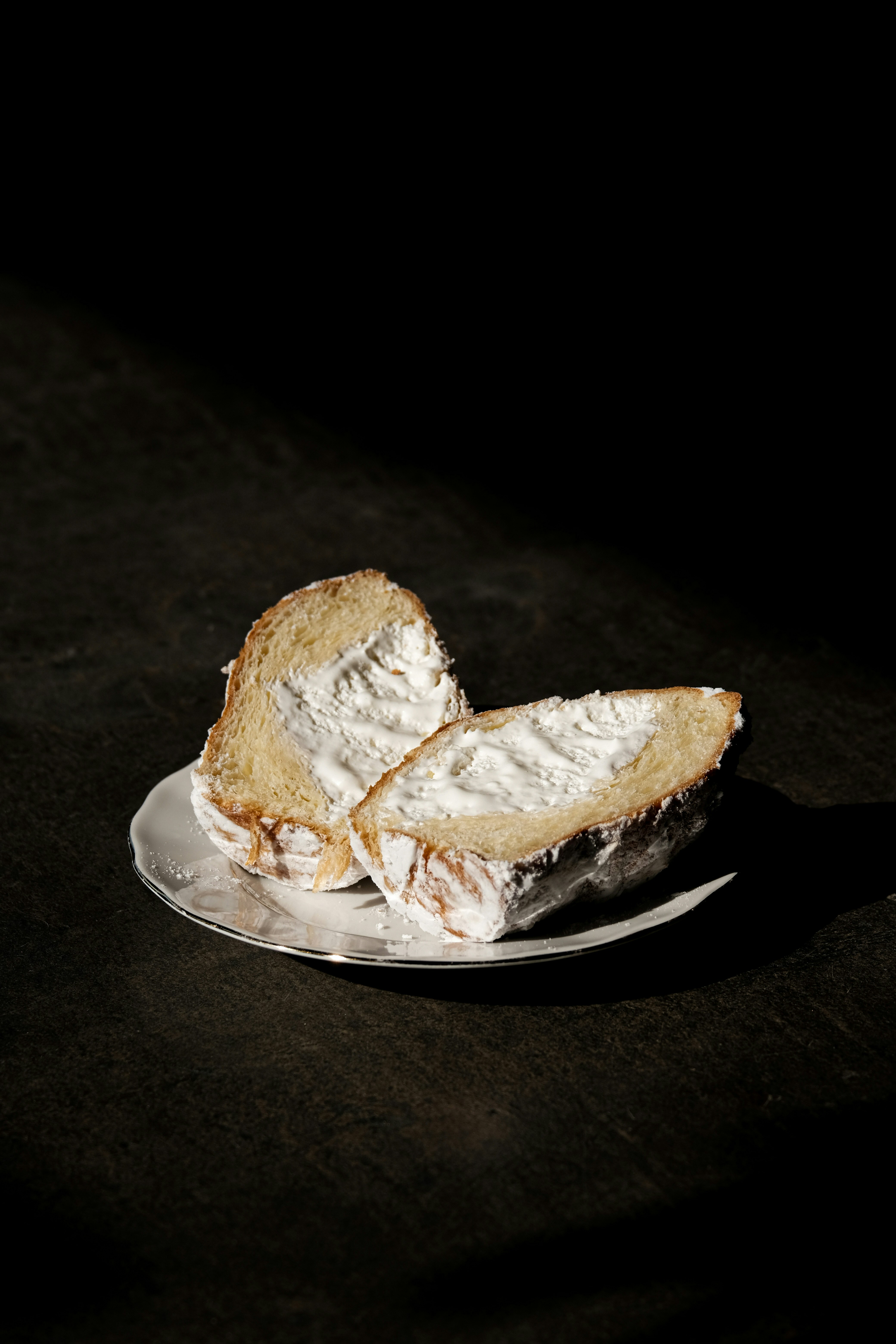Two pieces of bread sitting on top of a plate photo – Free Bread Image ...