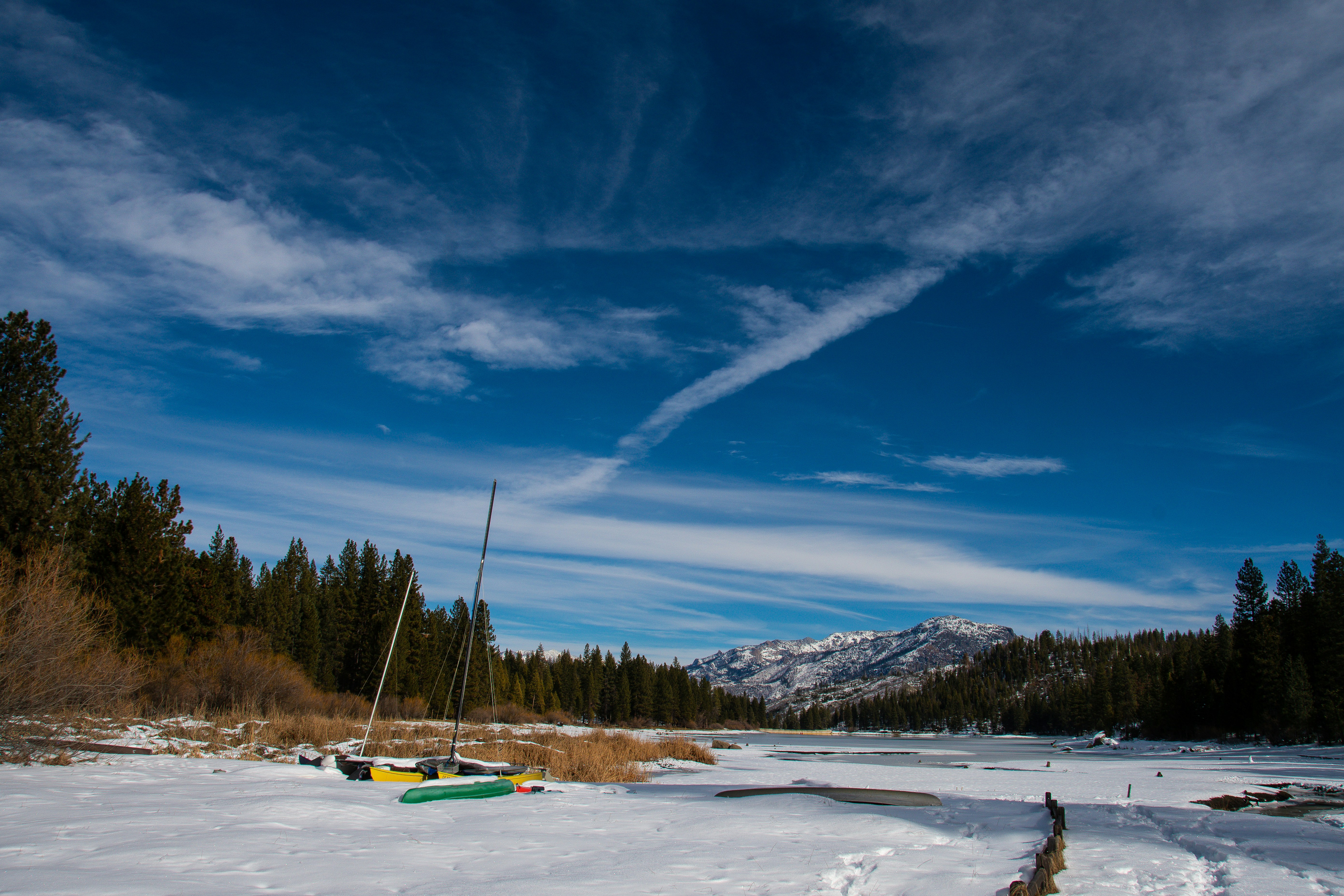 a boat sitting on top of a snow covered field
