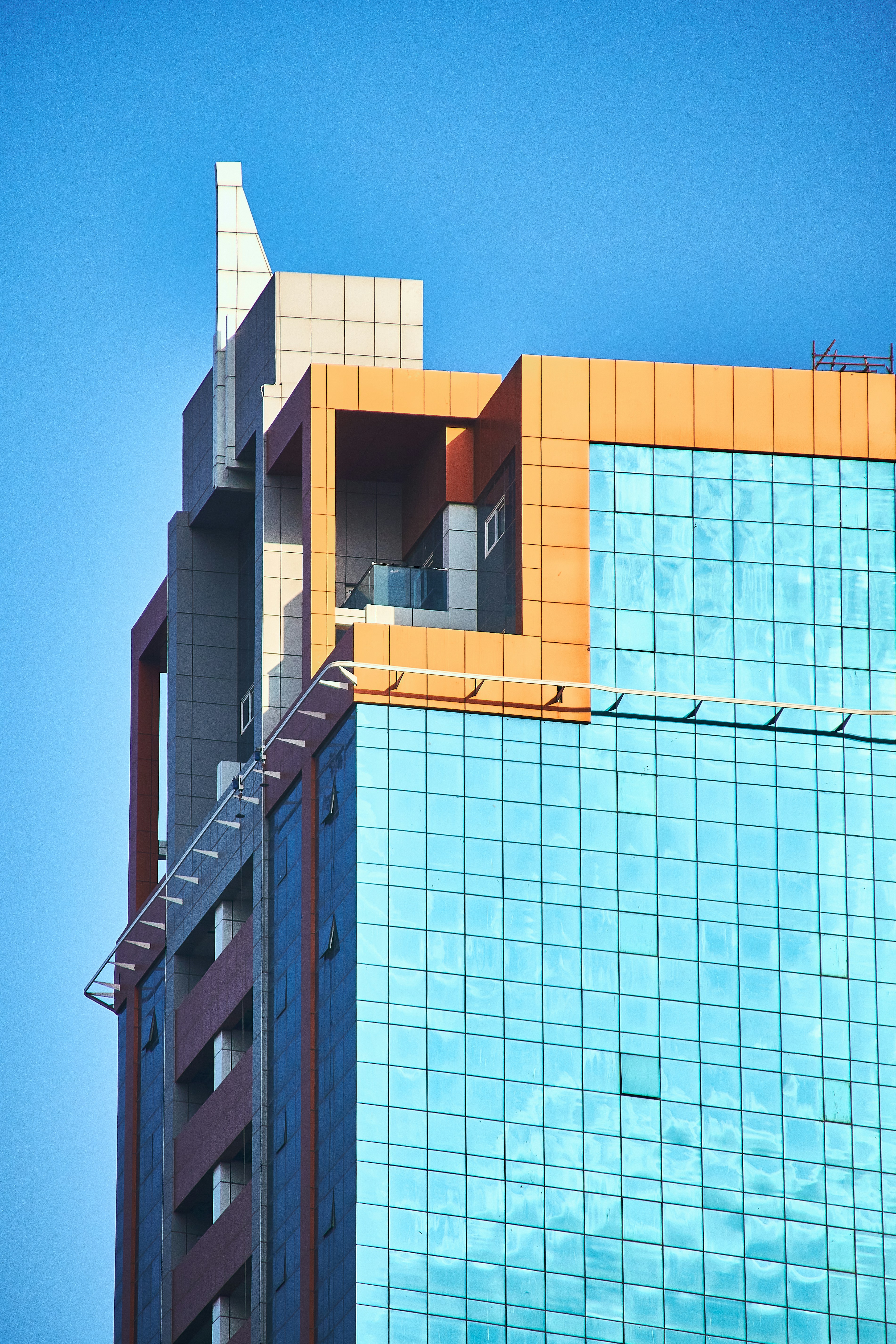 A tall building with a sky scraper on top of it photo – Free Building ...