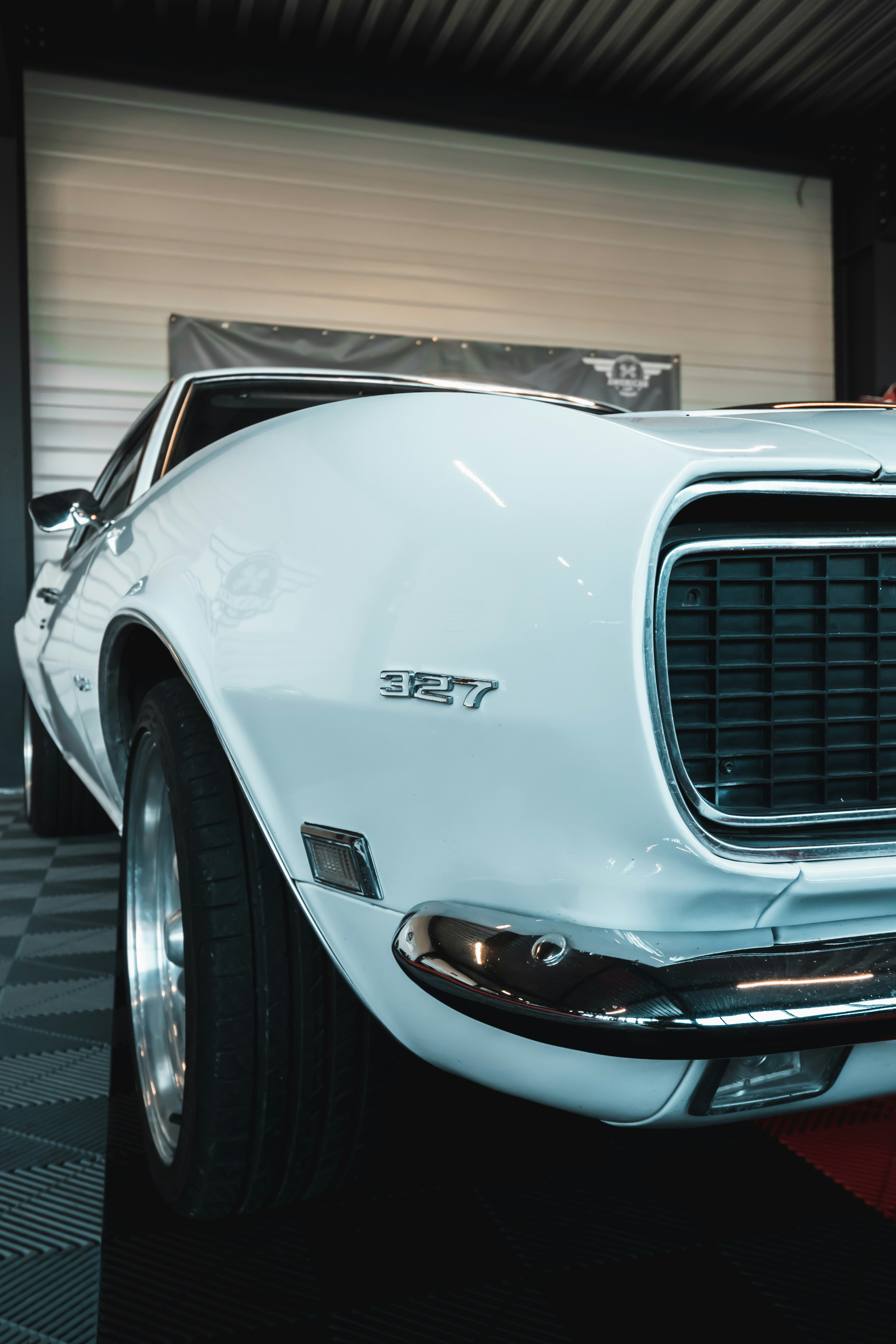 Front Quarter of a Classic Pontiac: Curves, Chrome, and a Quiet Garage Glow