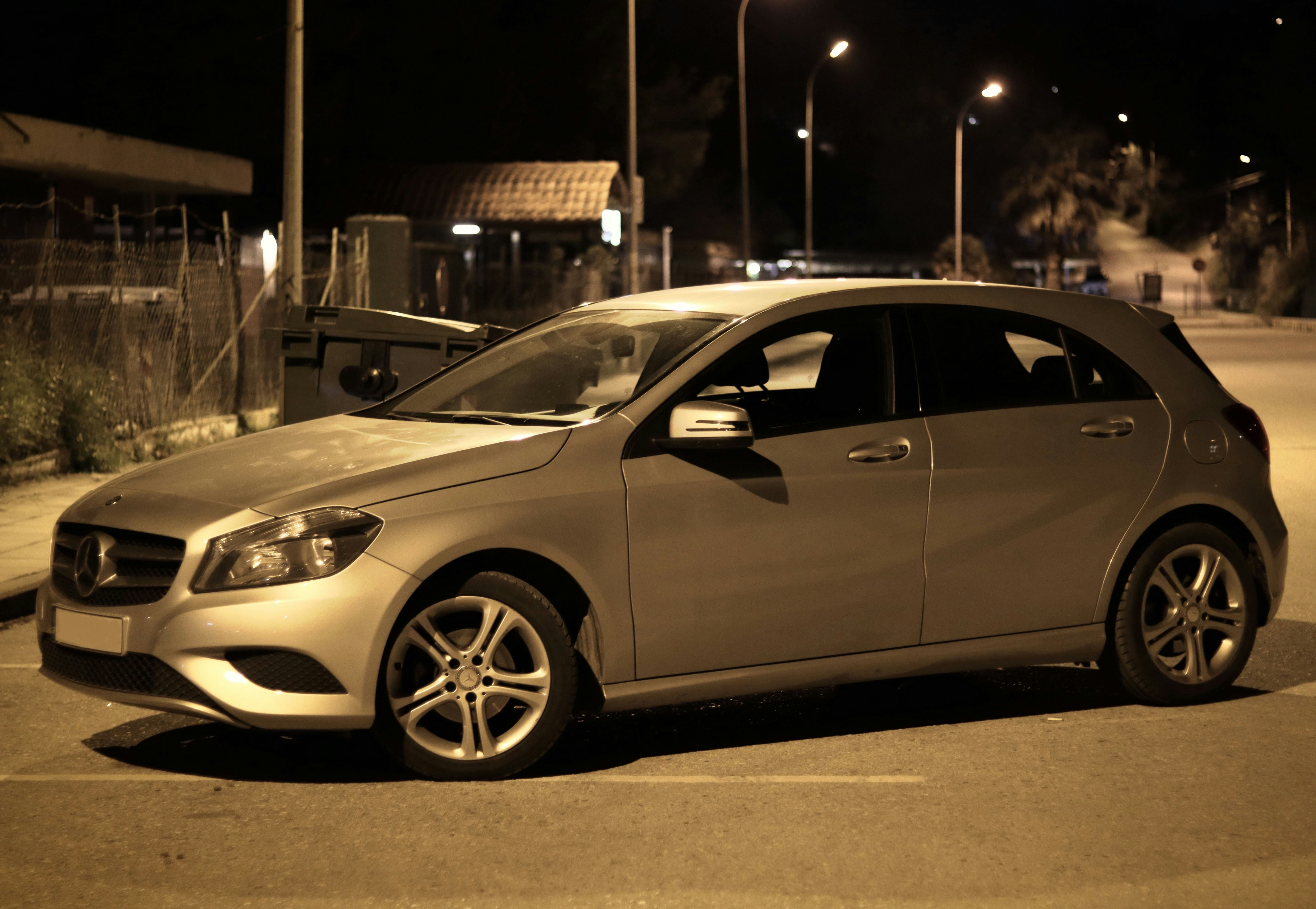 a car parked in a parking lot at night