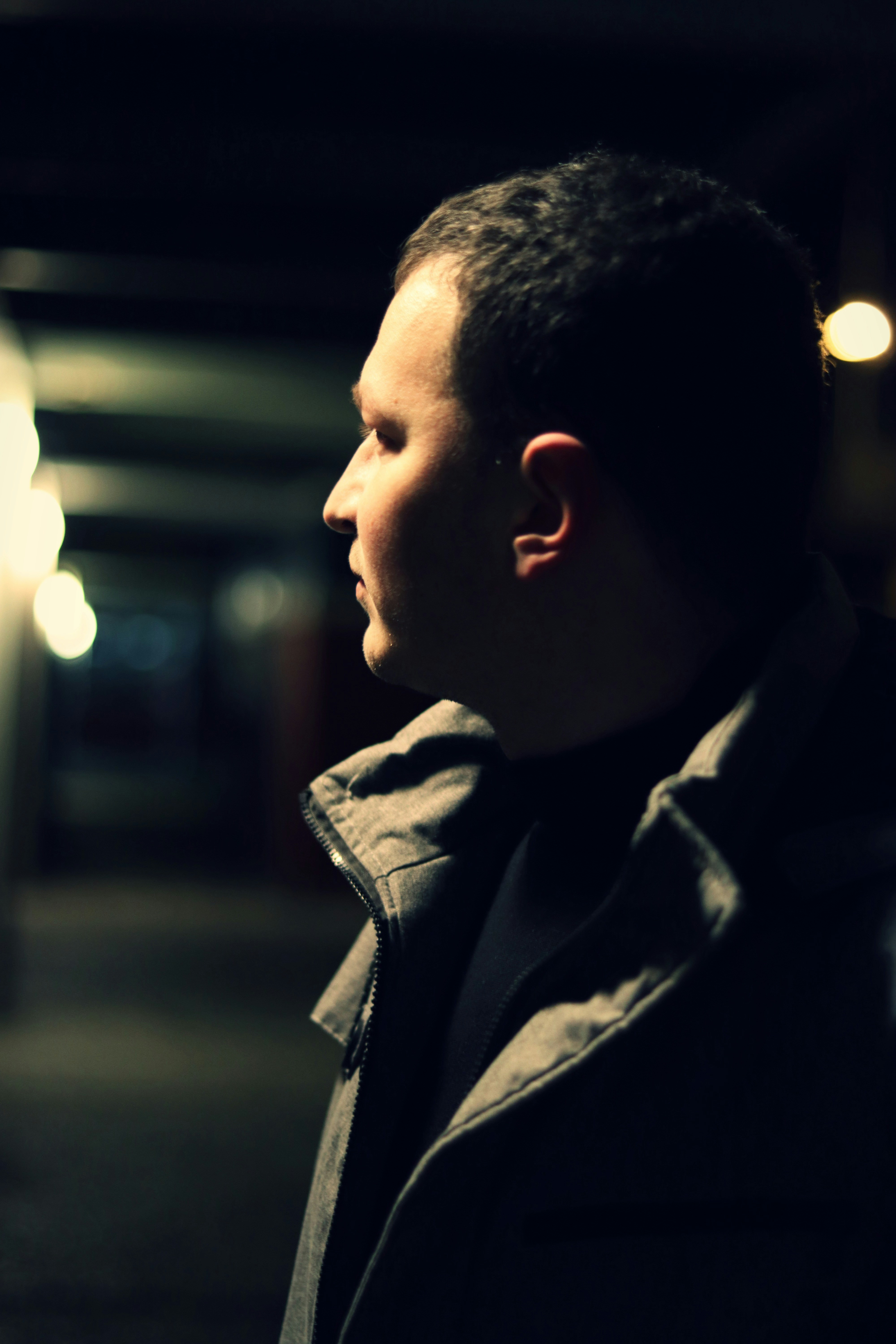 Side Profile in a Quiet Underground Glow