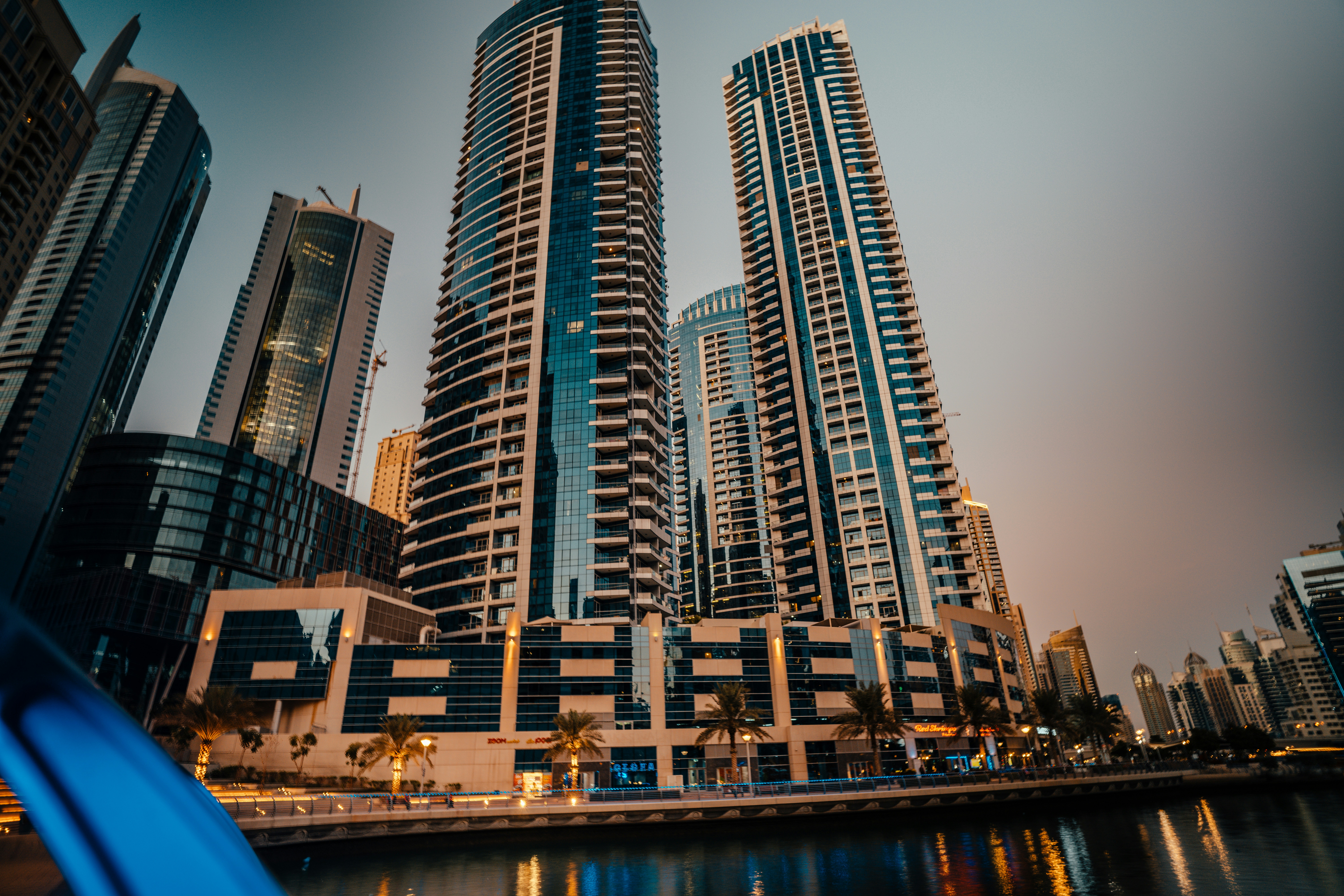 Glass Giants at Dusk: A Marina Skyline Framed by Water and Light