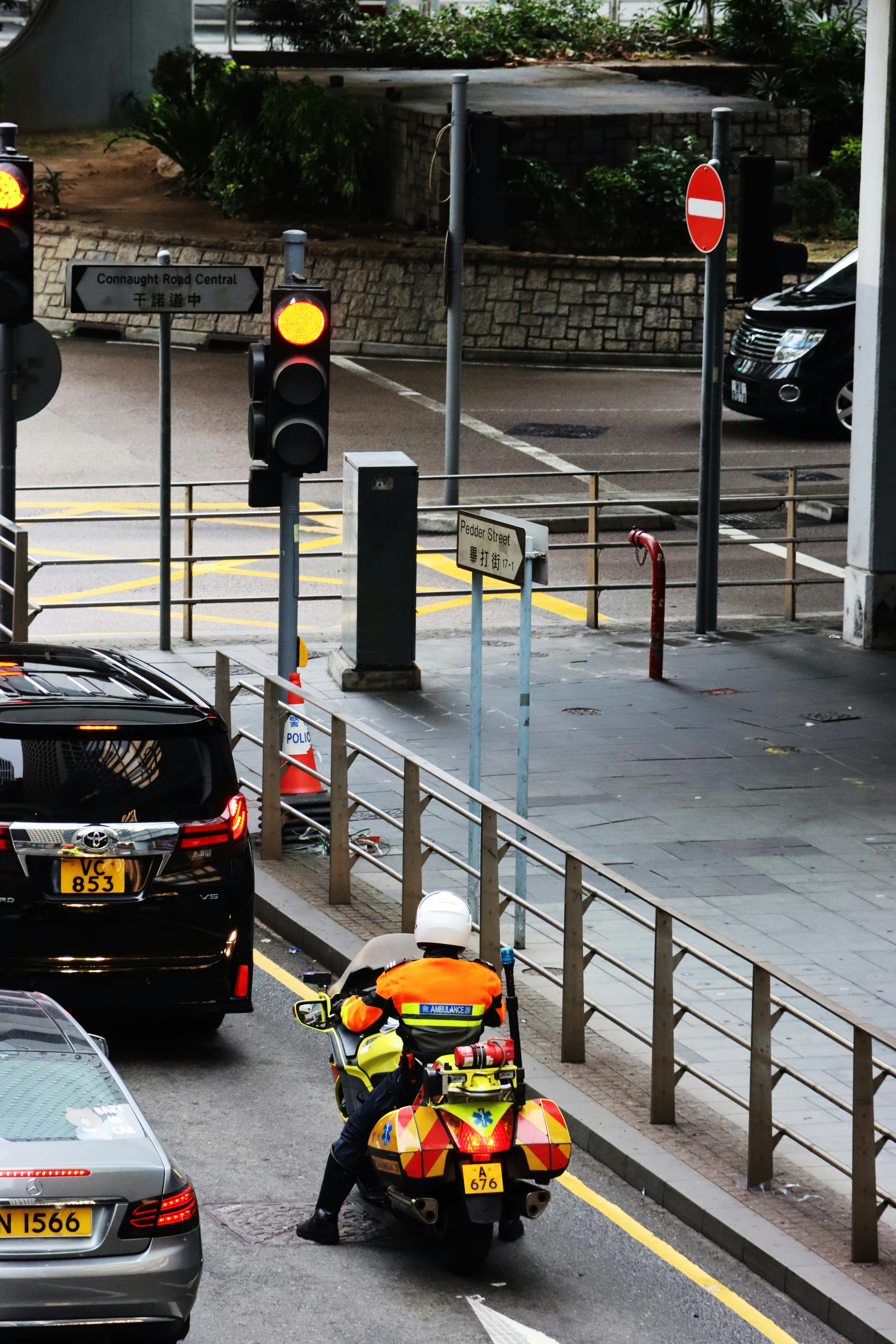 A man on a motorcycle in the middle of traffic photo – Free Central ...
