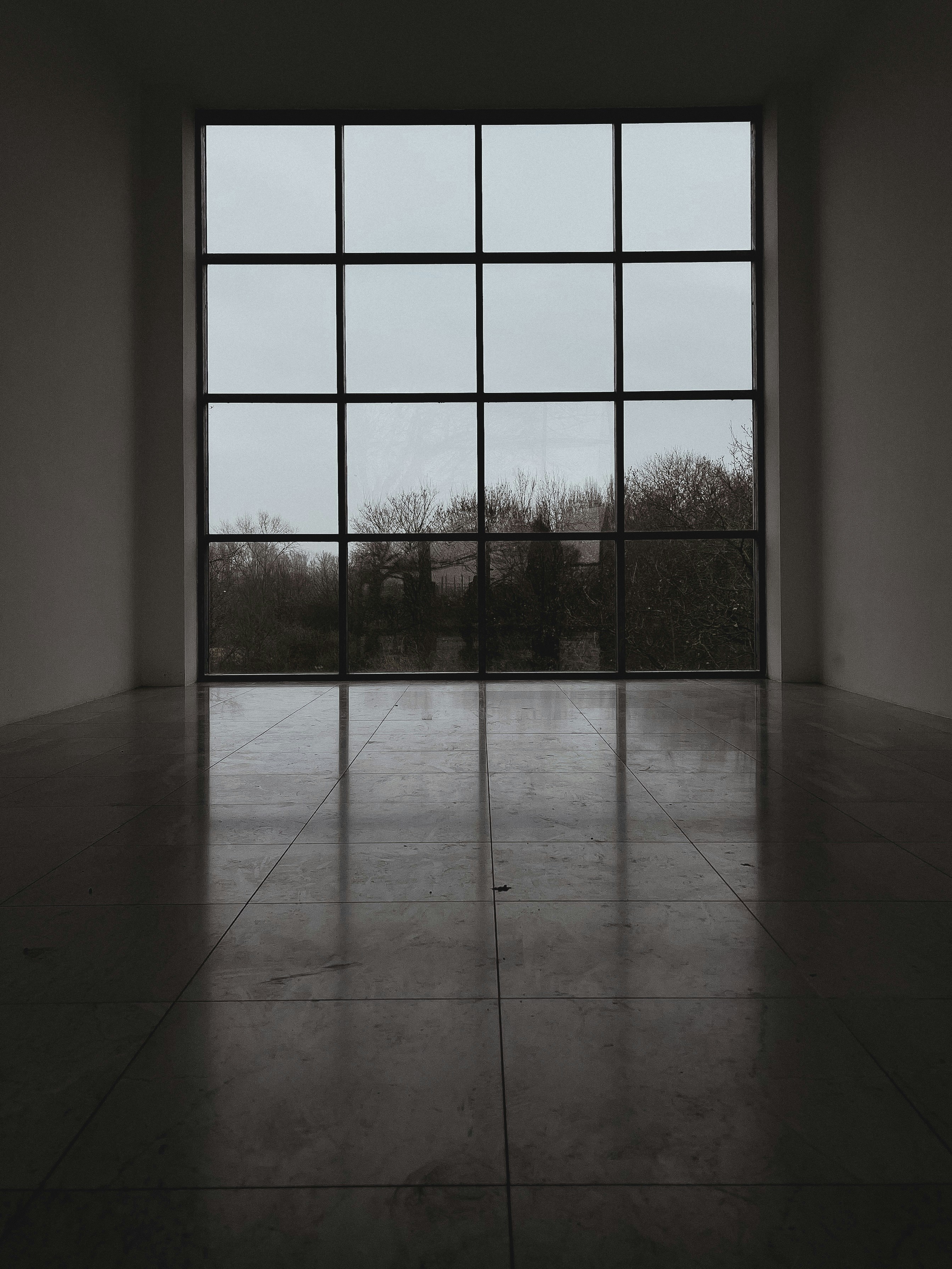 an empty room with a large window in it