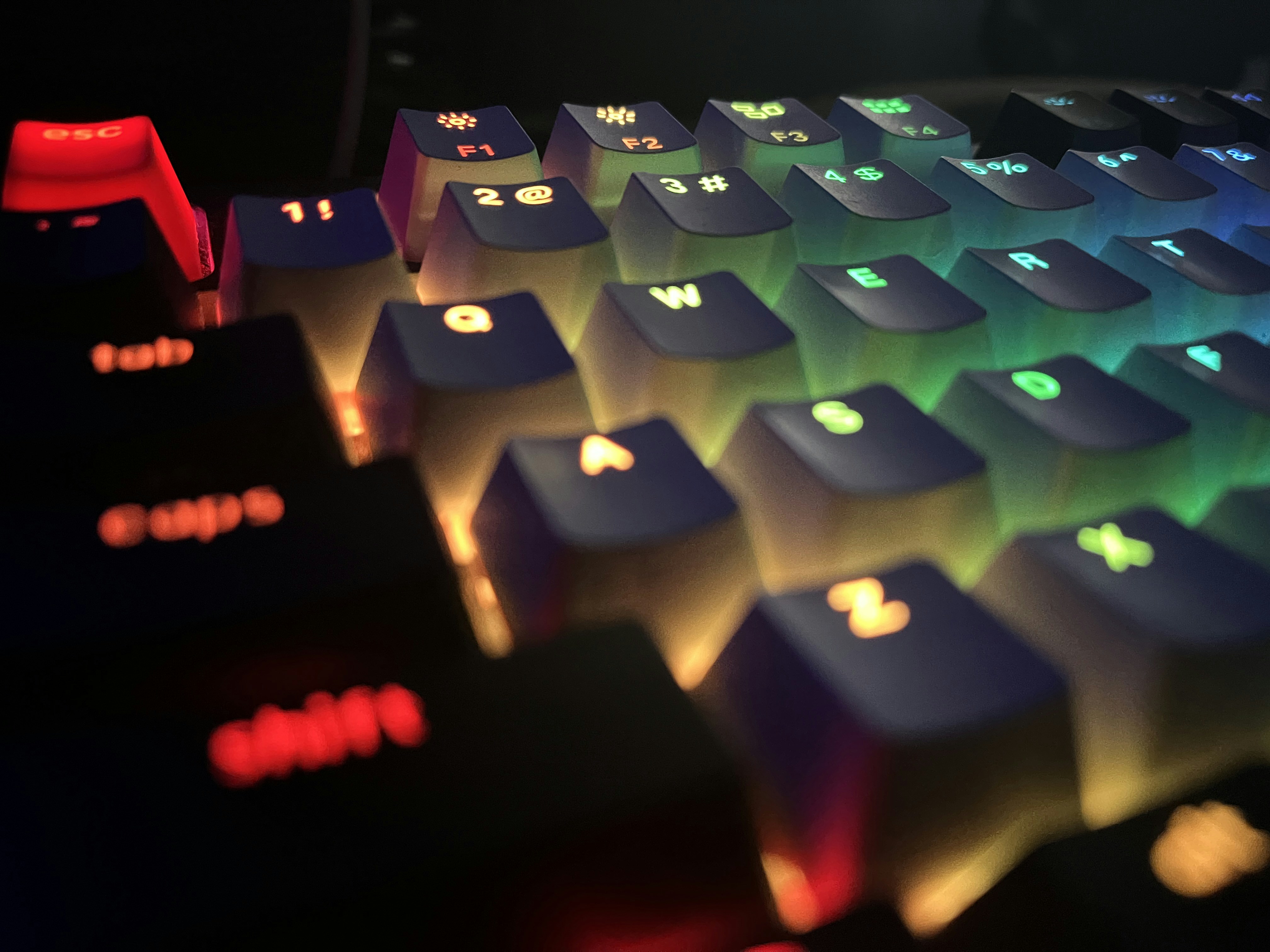 A close up of a computer keyboard with glowing keys photo – Free ...