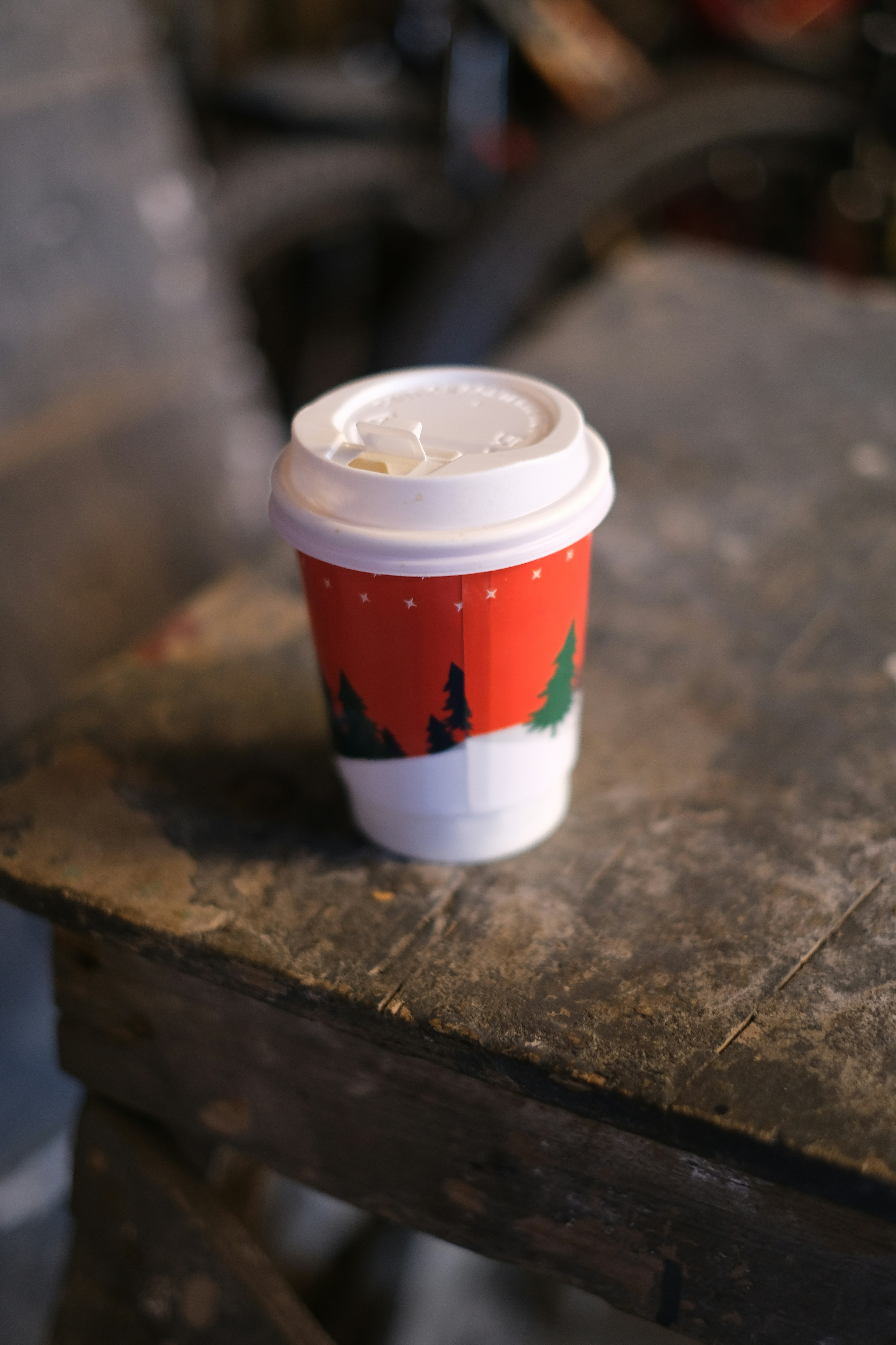 Holiday Red Cup on Weathered Wood: A Quiet Moment at the Café