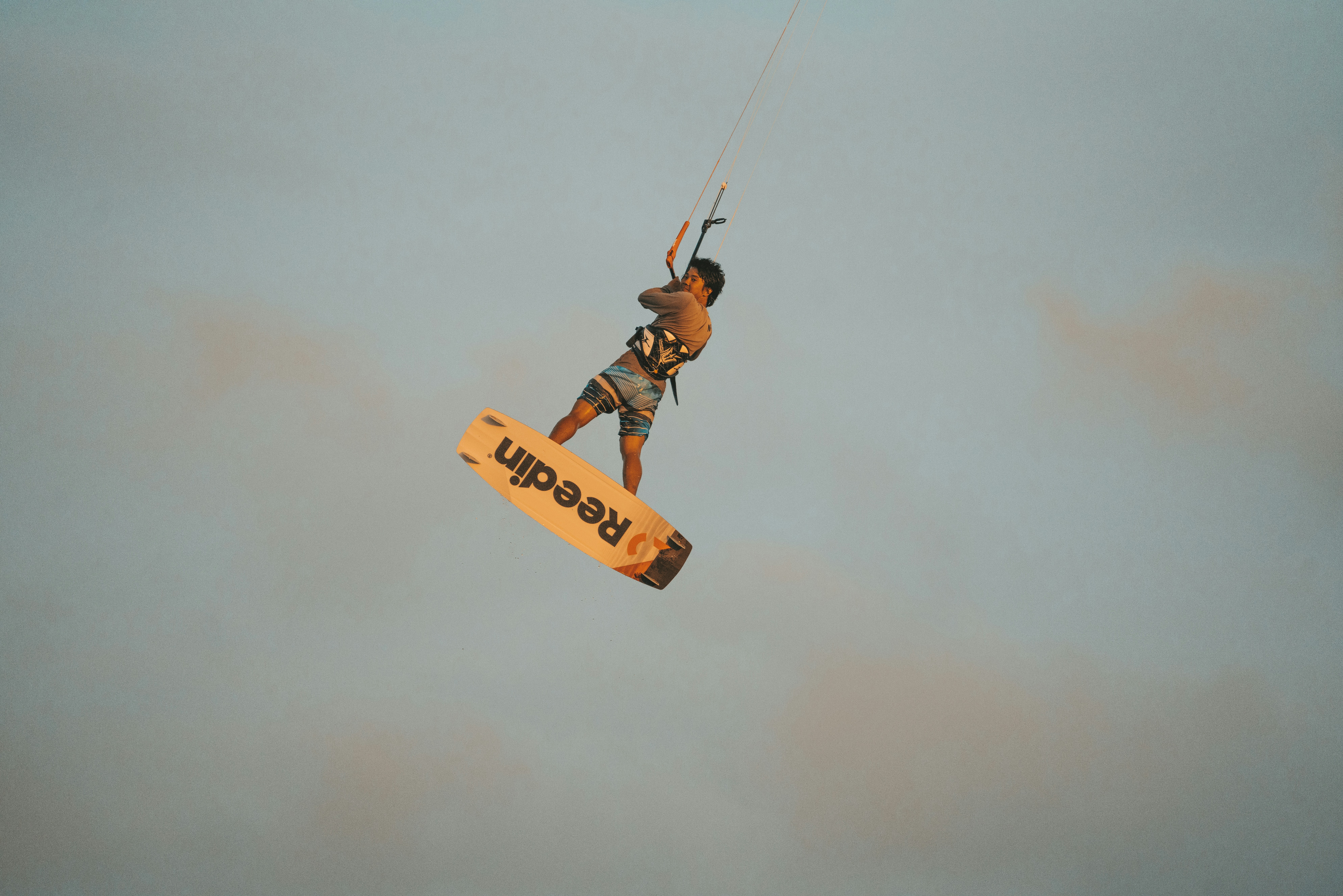 A man on a surfboard being pulled by a rope photo – Free Ride Image on ...