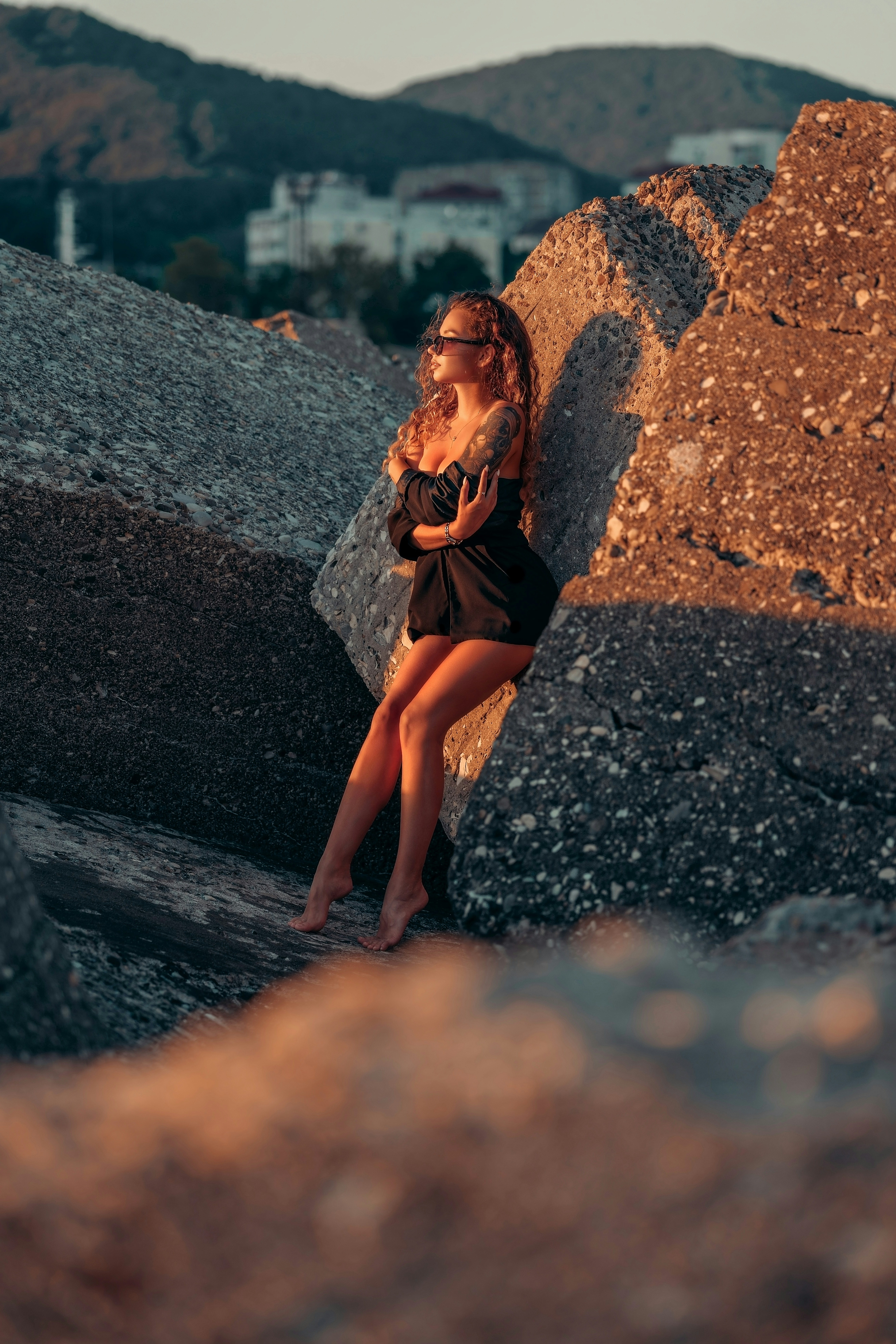 Edge of Light: Solitary Portrait Among Sun-Warmed Coastal Boulders