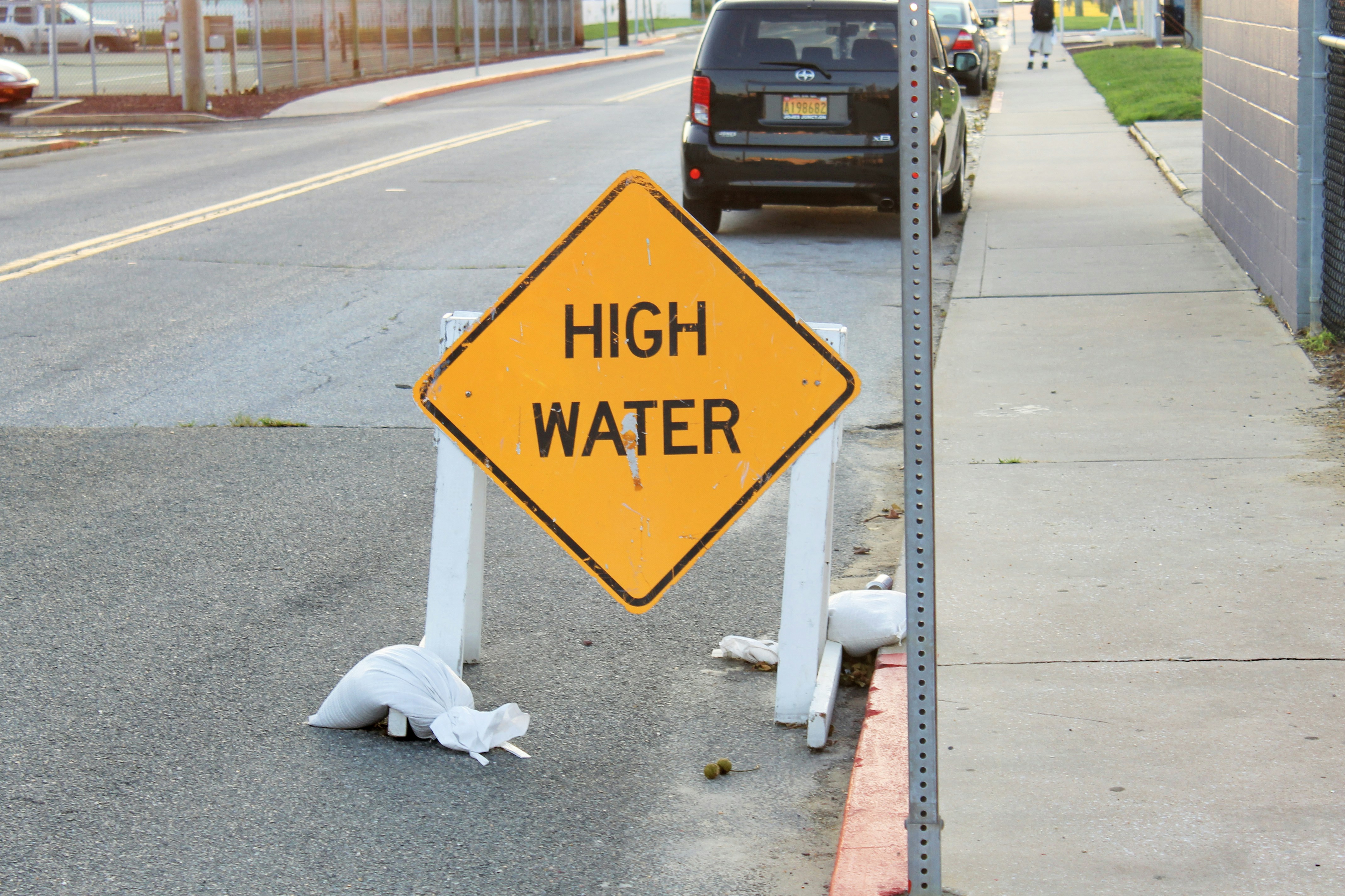 A high water sign on the side of the road photo – Free Usa Image on ...