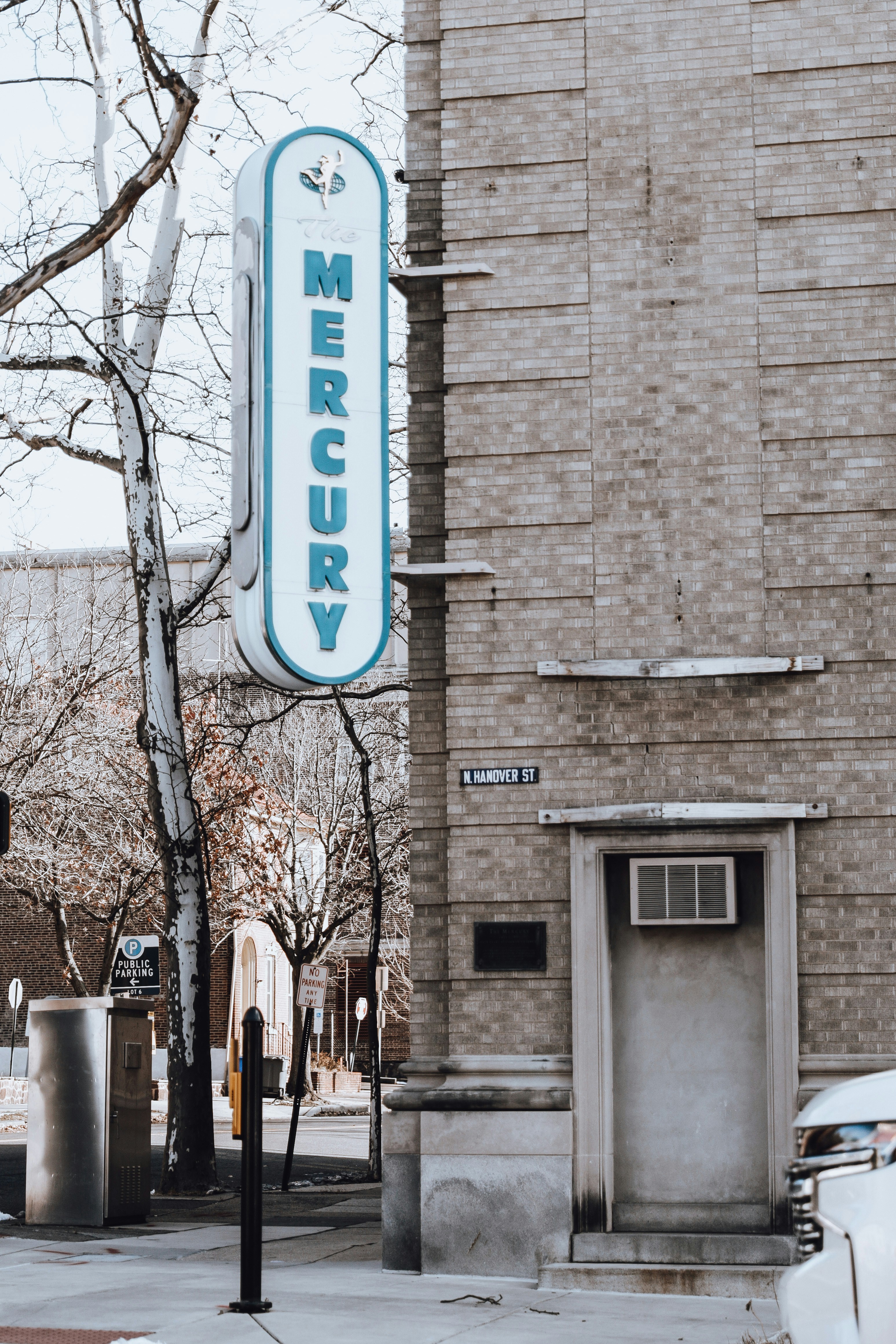 Neon Mercury at a Quiet Street Corner