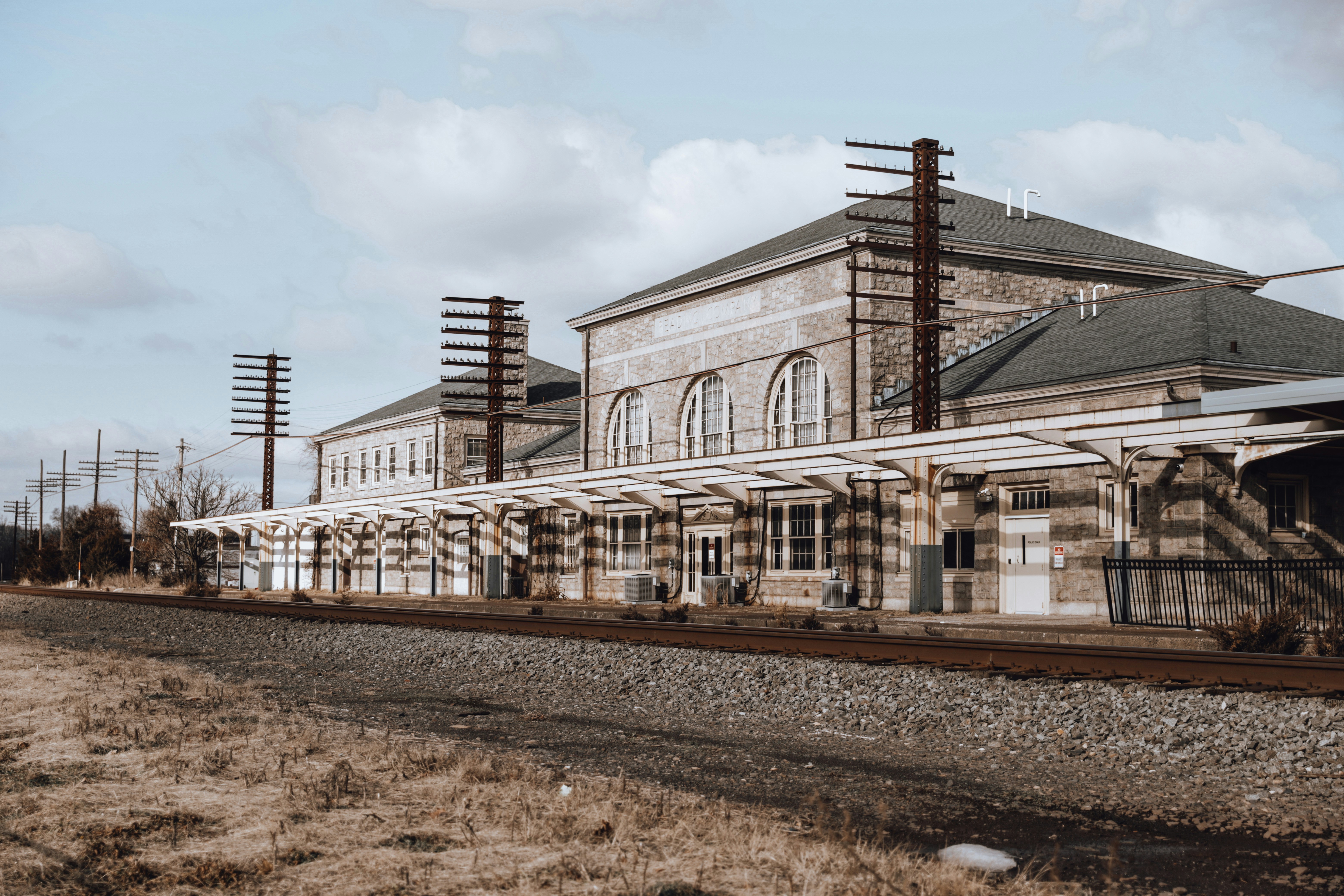a train station with a train on the tracks