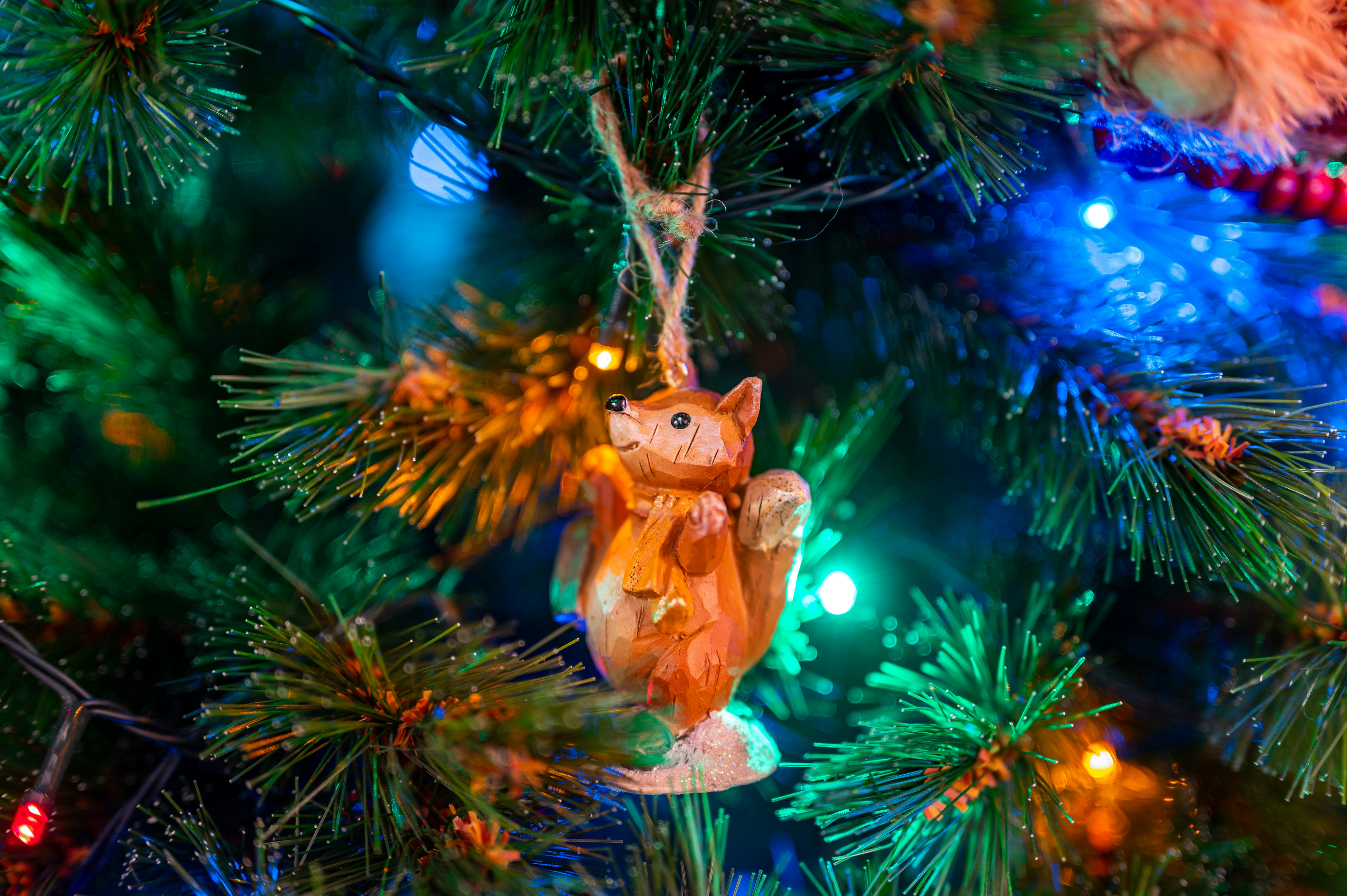 Wooden Owl Adrift Among Multicolored Christmas Lights