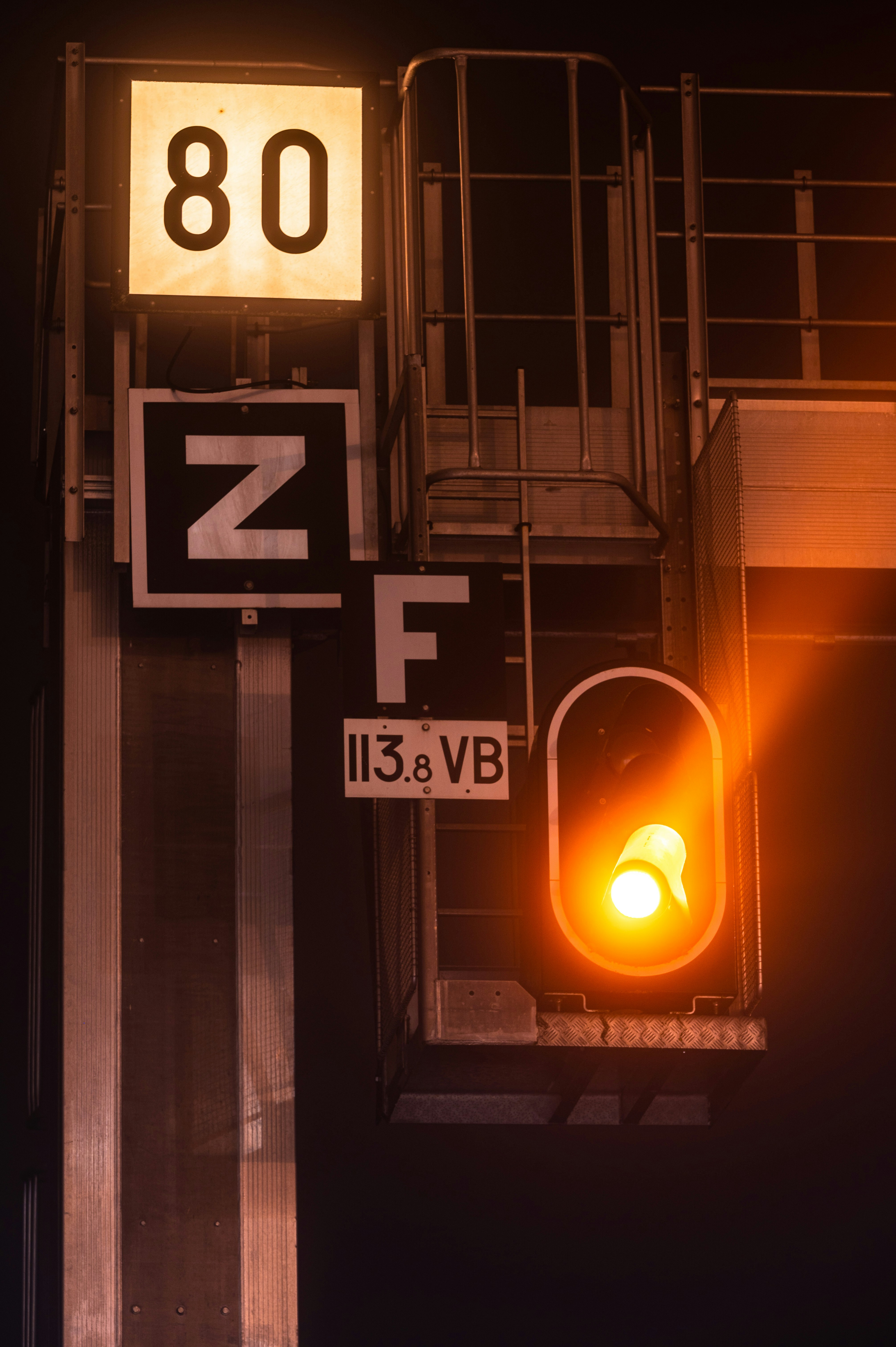 Low‑Sun Signal: The Glowing Orange at a Rail Crossing