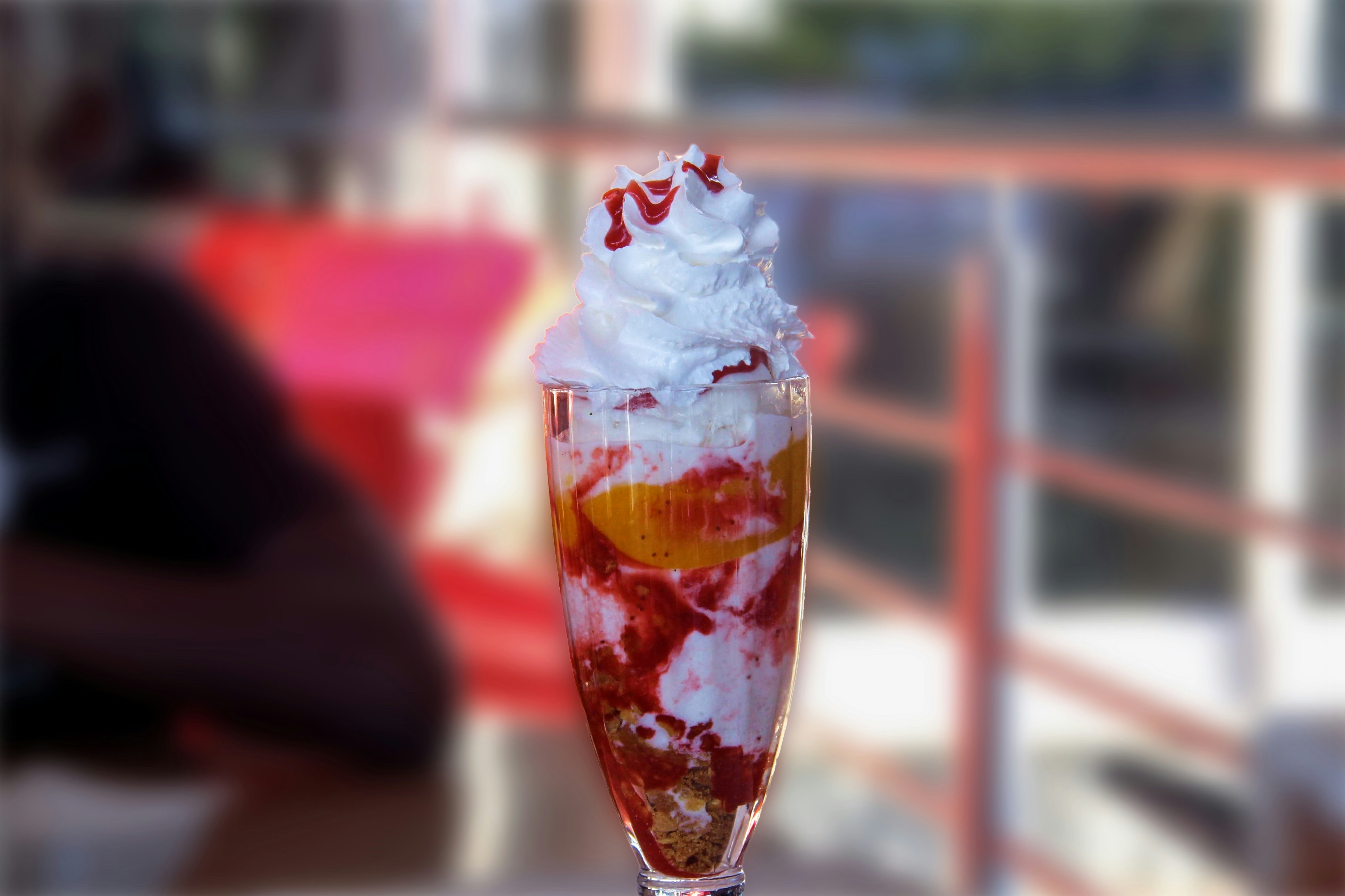 A tall glass filled with ice cream and fruit photo – Free Dessert Image ...