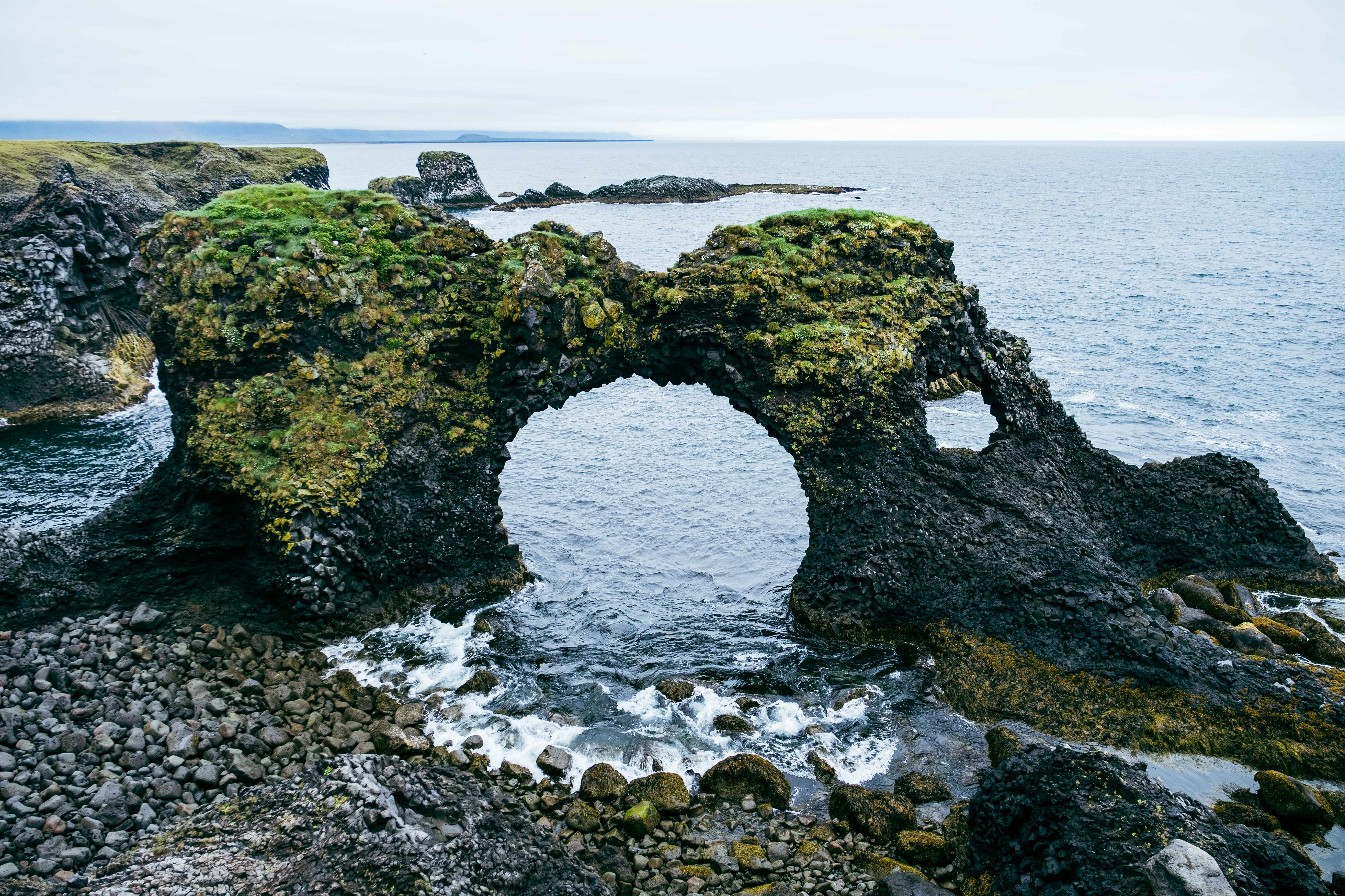 Moss-Crowned Sea Arch Carved by Tides