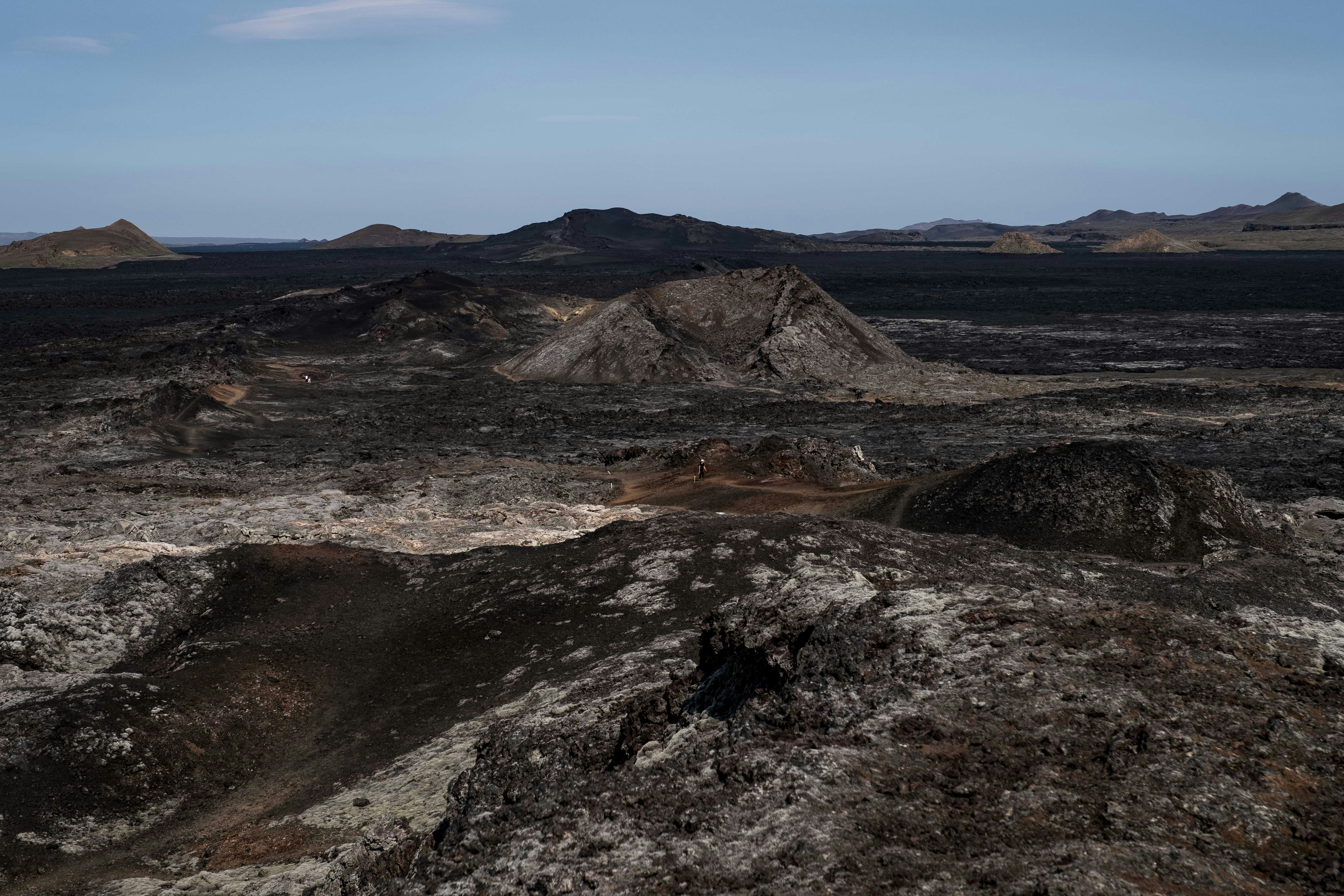 A barren landscape with mountains in the distance photo – Free Krafla ...