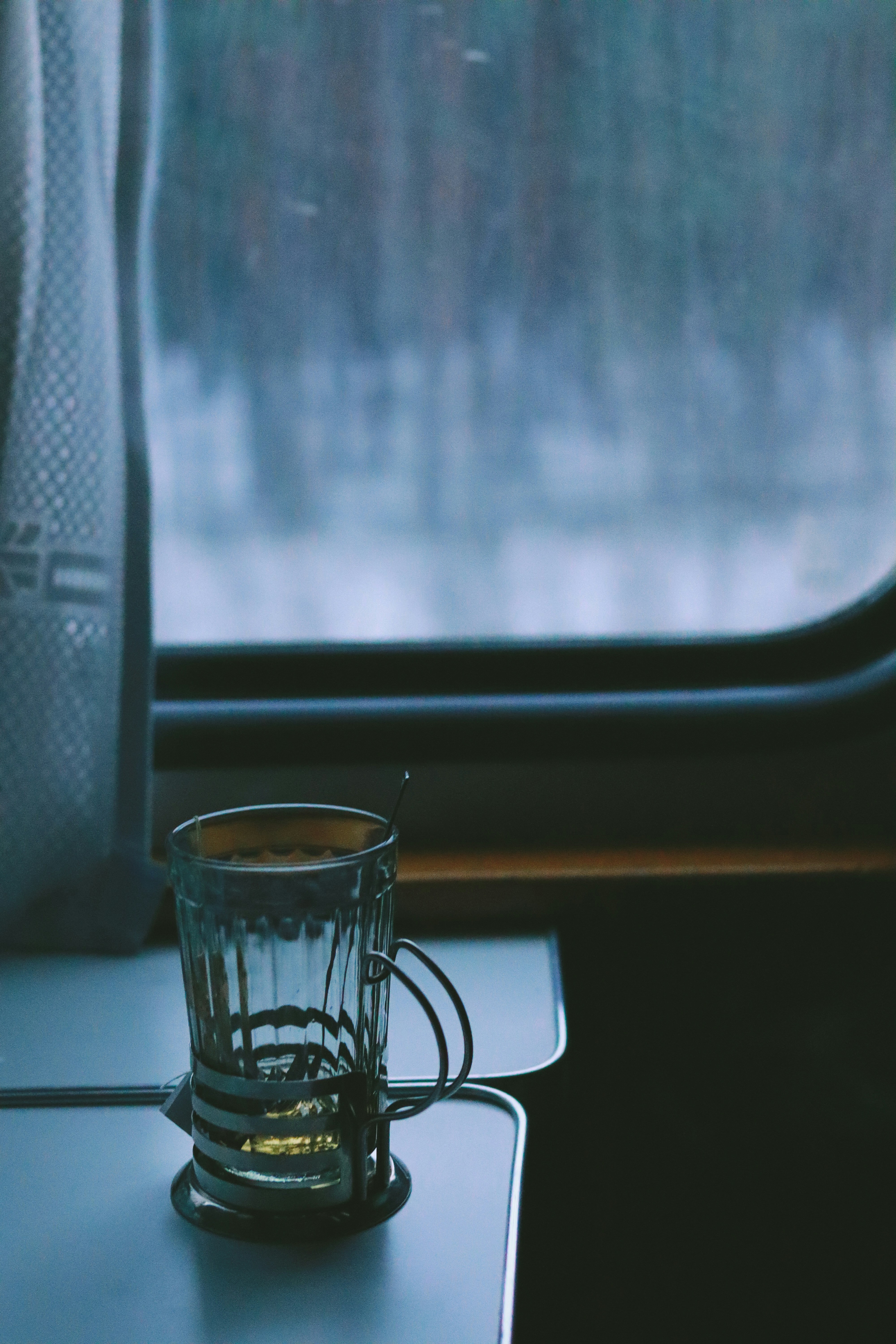 Moody Window Seat: A Glass of Tea in a Quiet Train Car