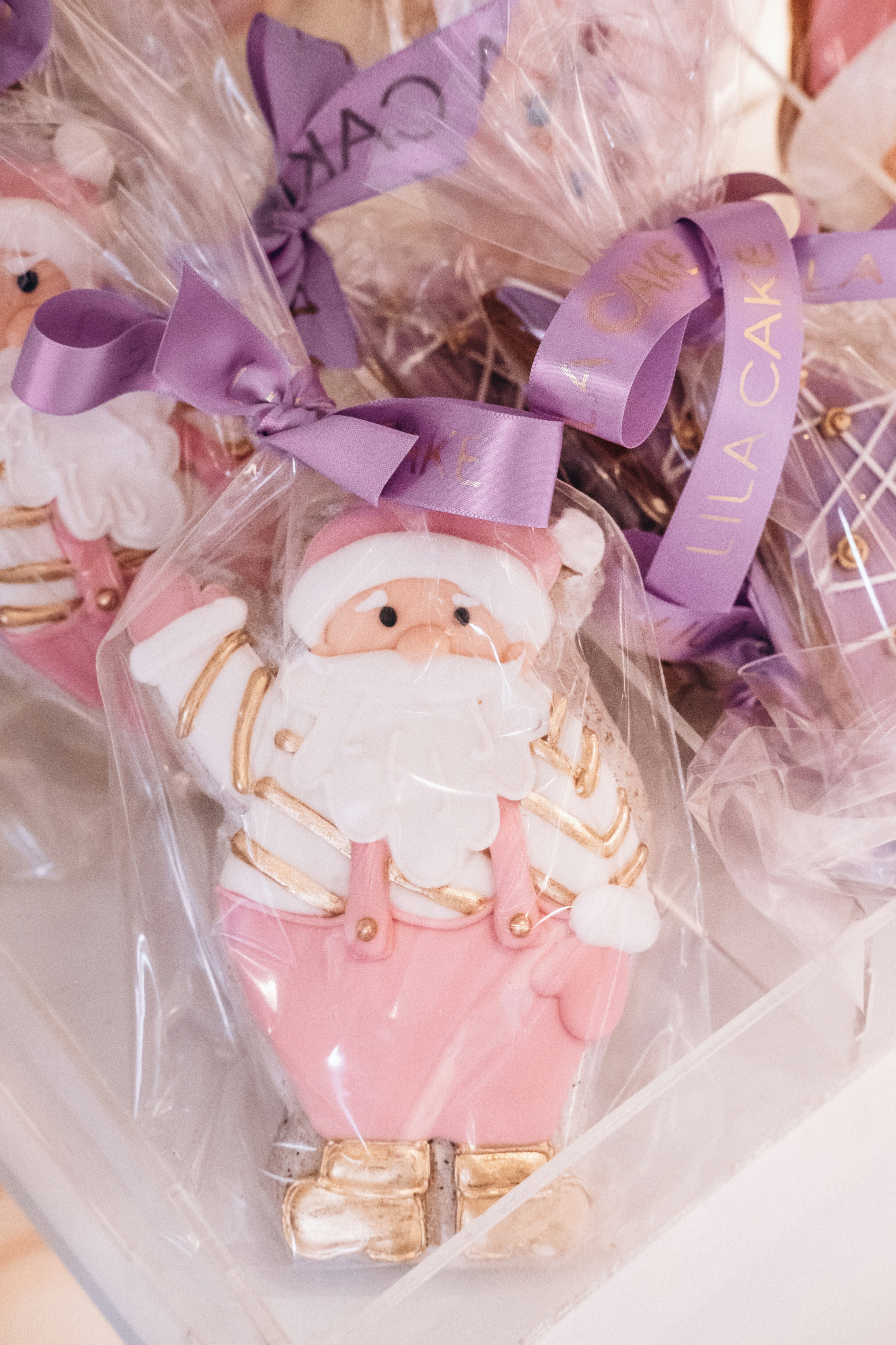 A close up of a box of cookies with a santa clause photo – Free Sweets ...
