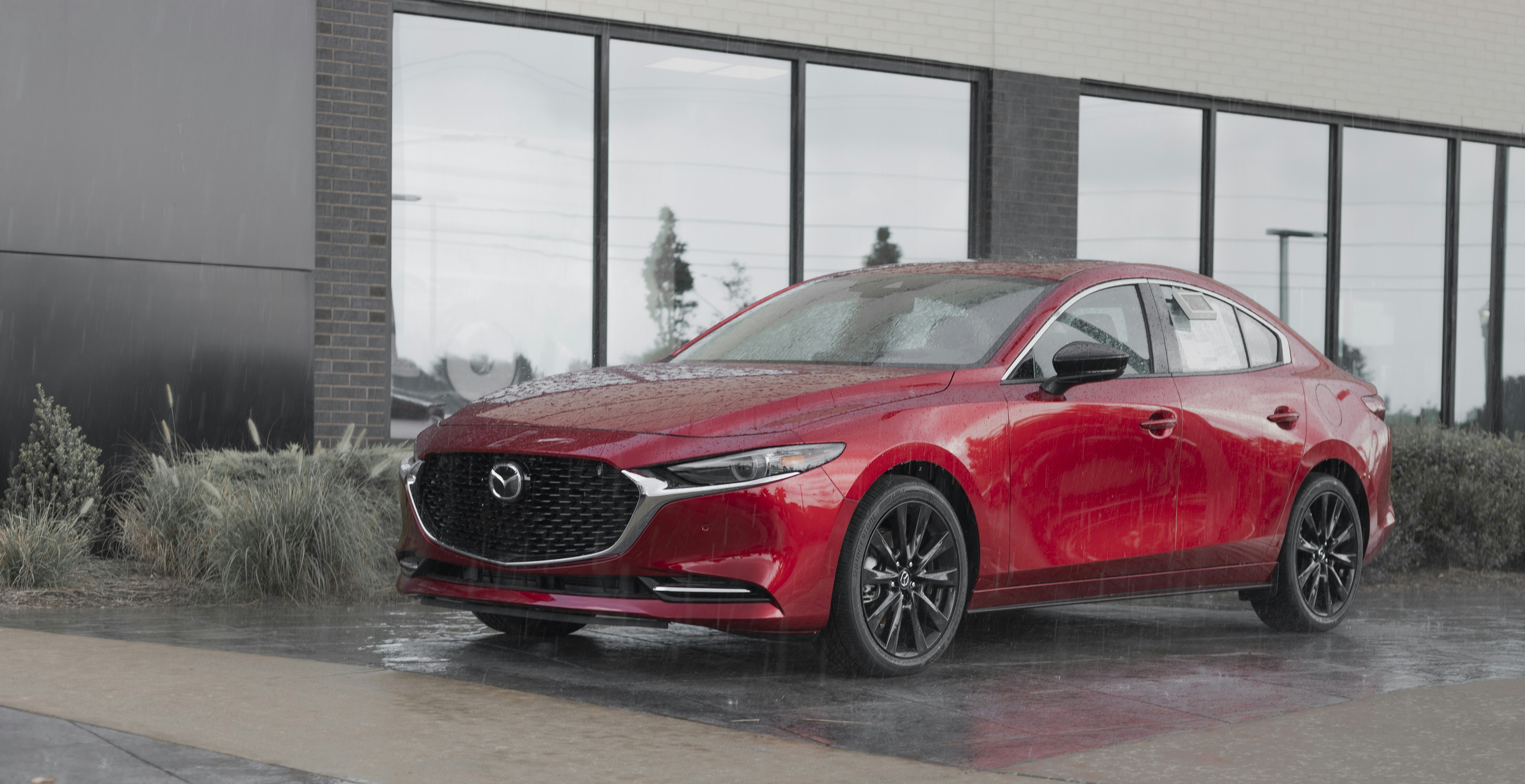 A red mazda car parked in front of a building photo – Free Nashville ...