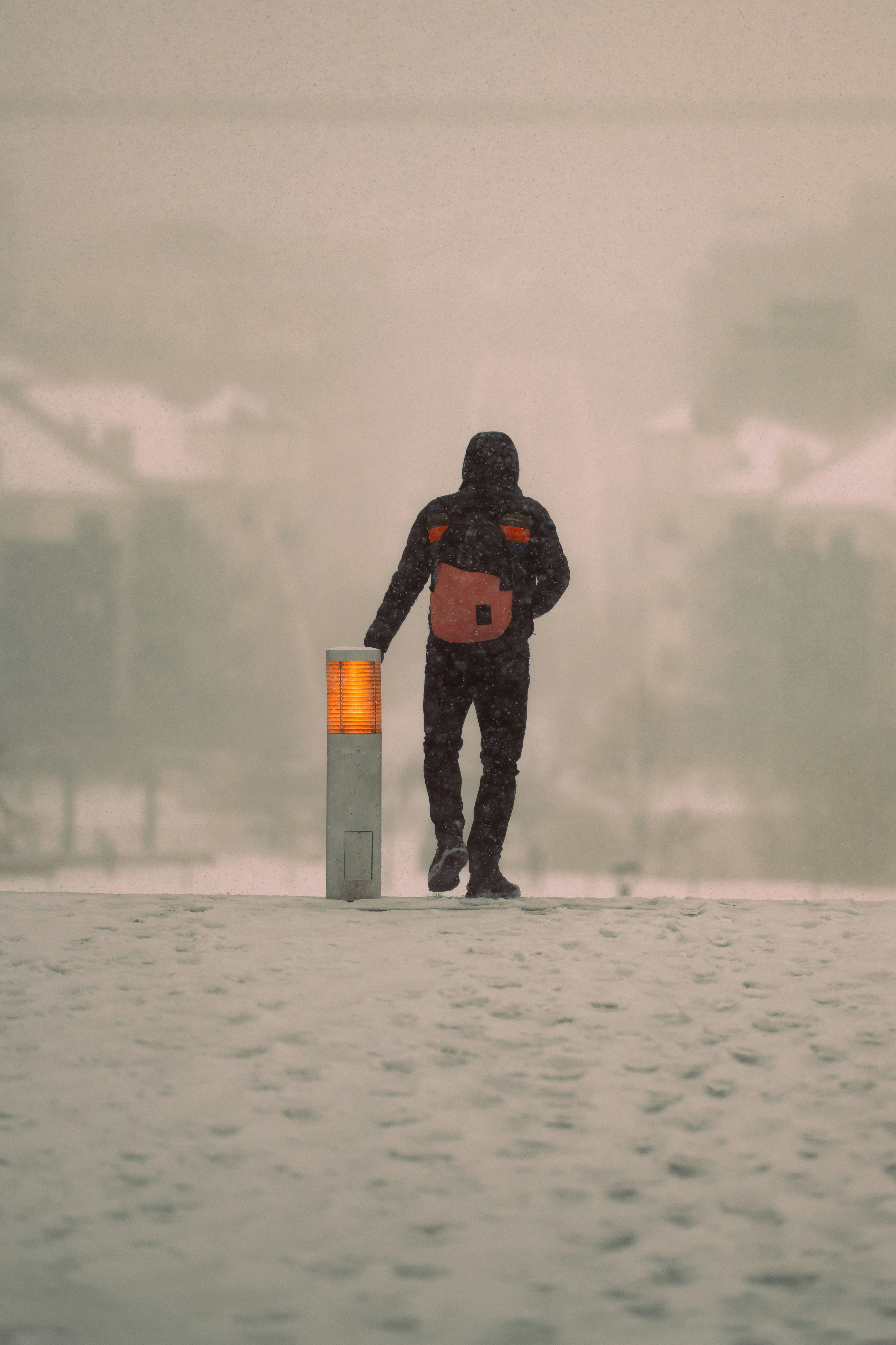 Snowbound Silhouette by the Orange Beacon