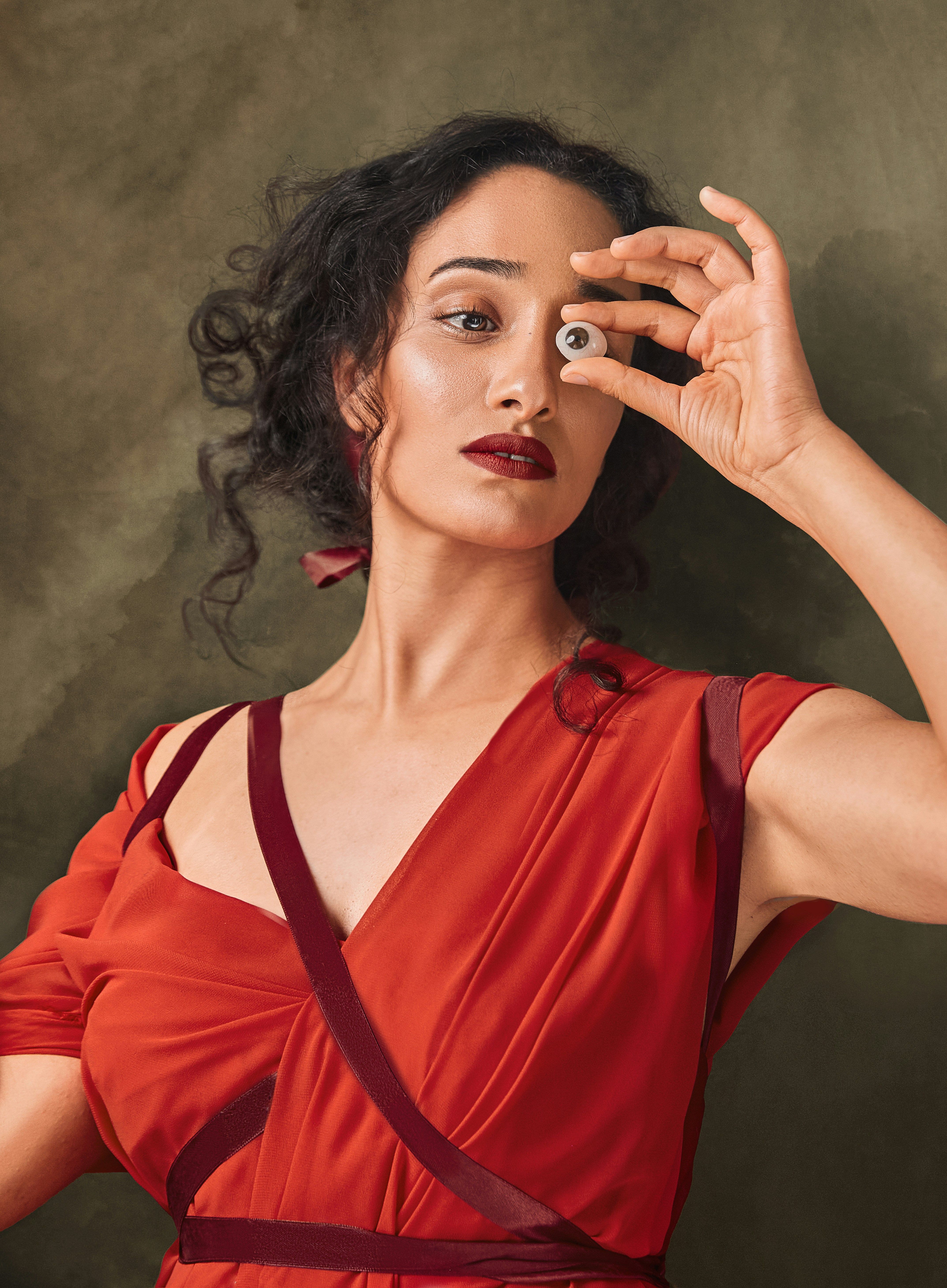 A woman in a red dress holding a ring photo – Free Woman Image on Unsplash