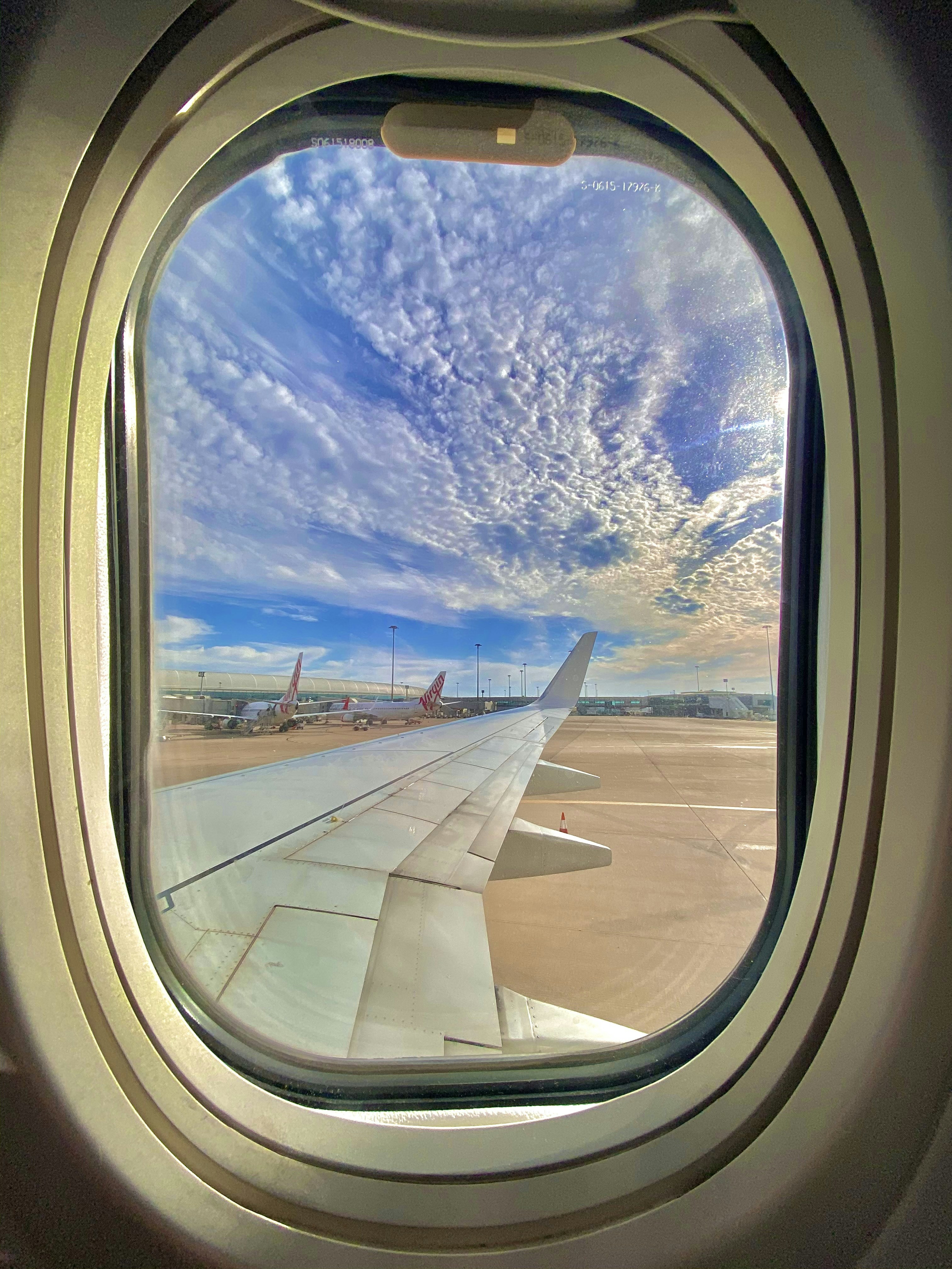 A view of the wing of an airplane through a window photo – Free Travel ...