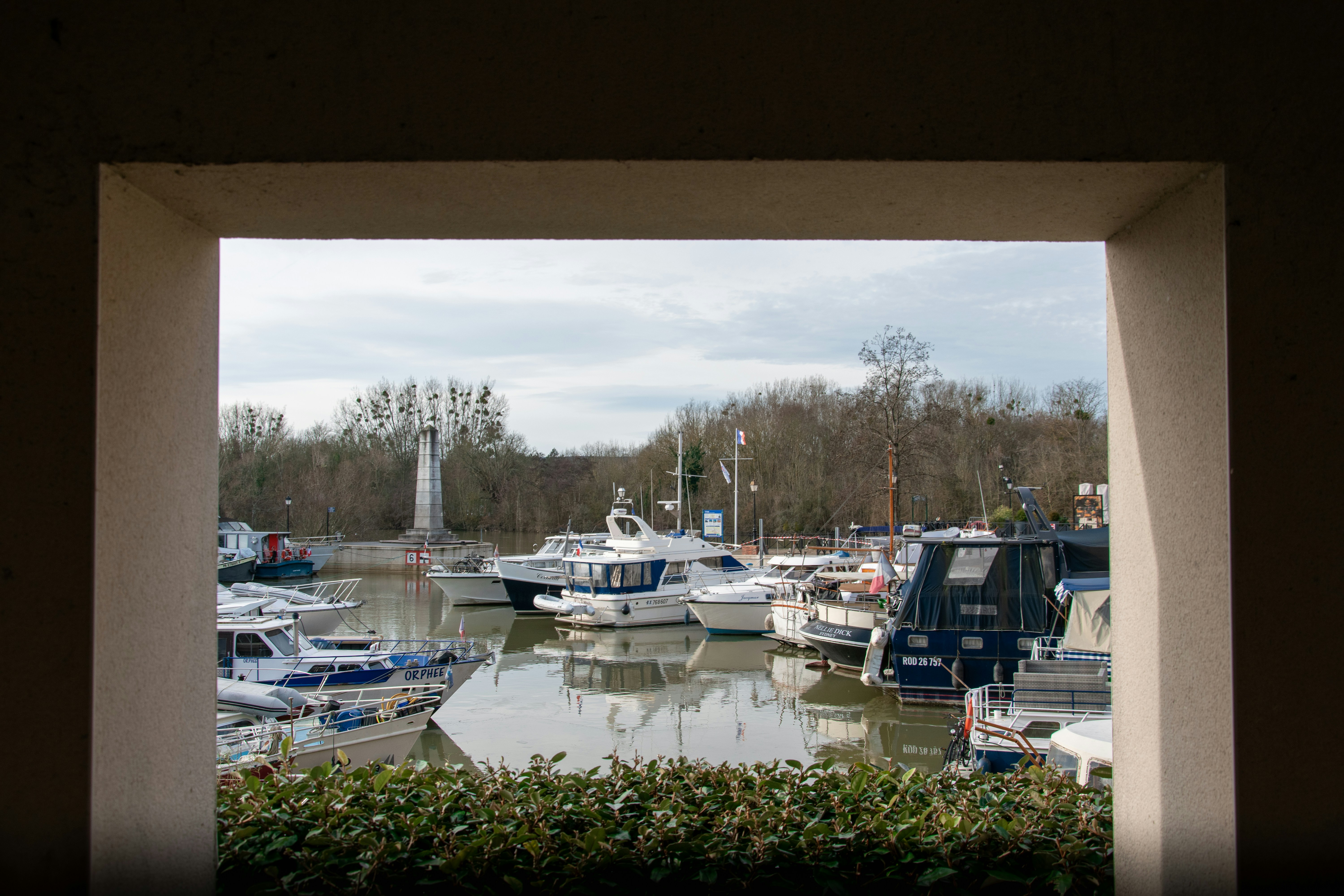 Framed Marina: Boats Resting Under a Calm Sky