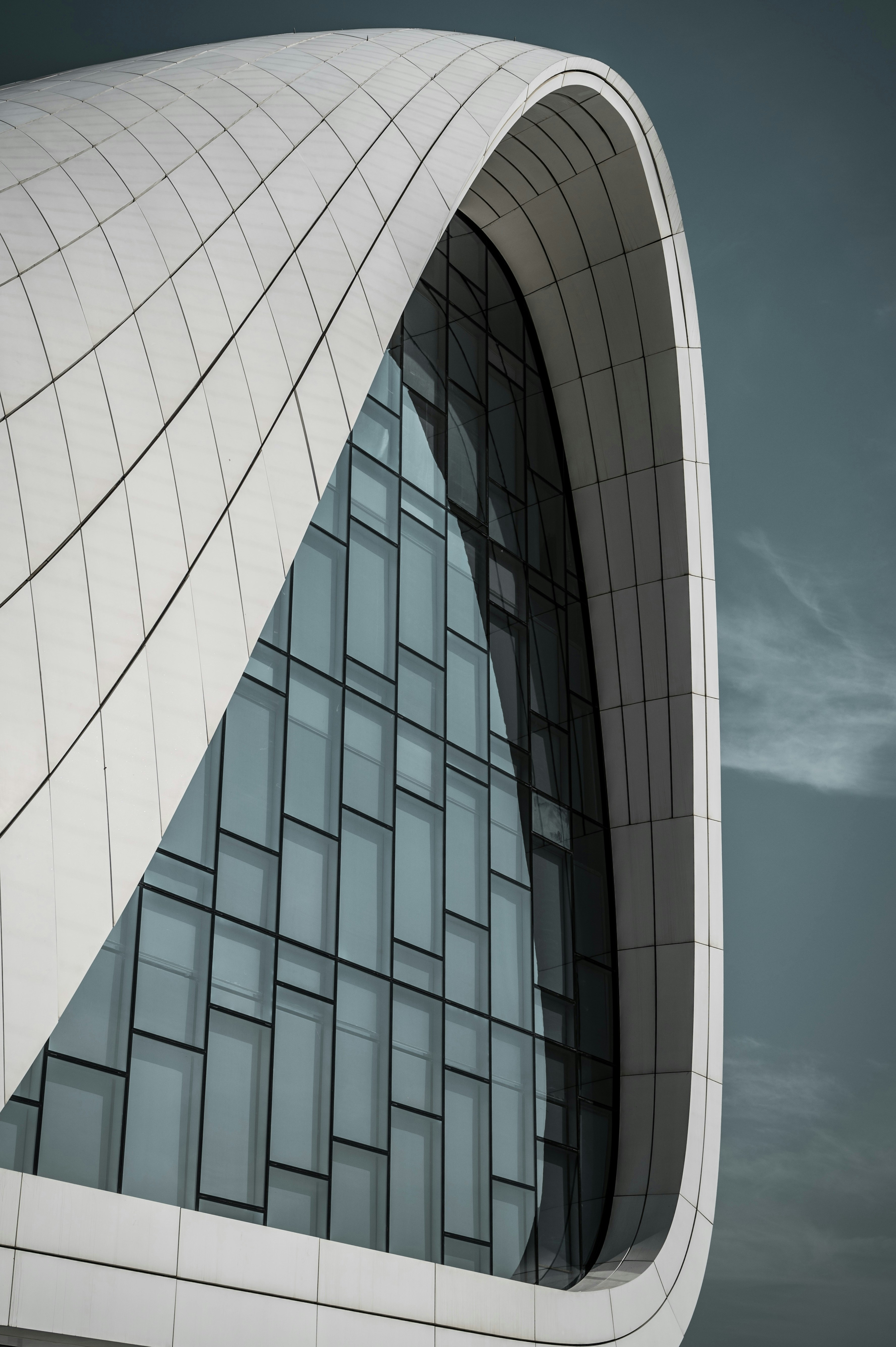 A very tall building with a curved roof photo – Free Azerbaijan Image ...