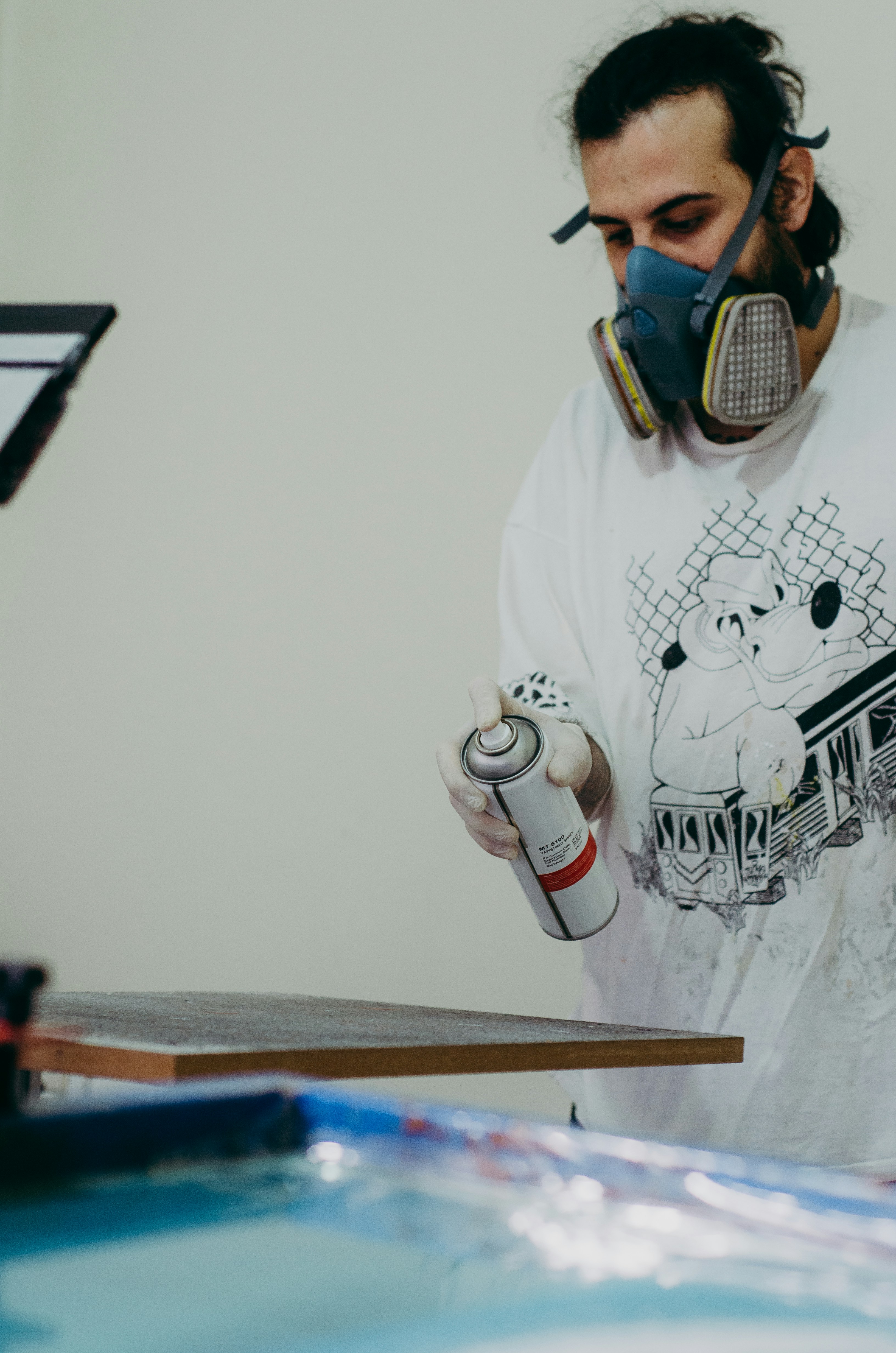 Studio Mist: A Focused Portrait Behind a Painter's Mask