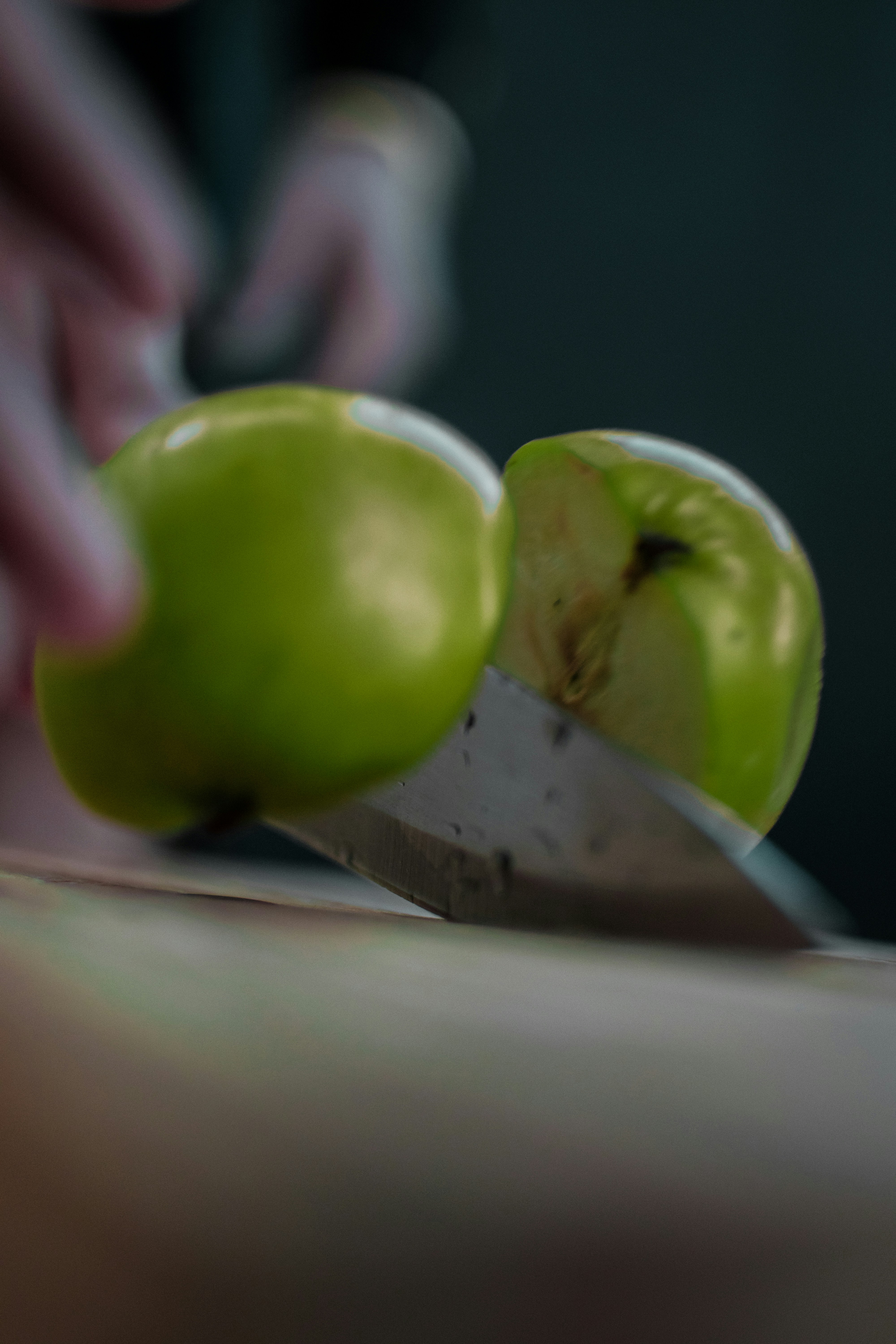 A person cutting an apple with a knife photo – Free Photo ideas Image ...