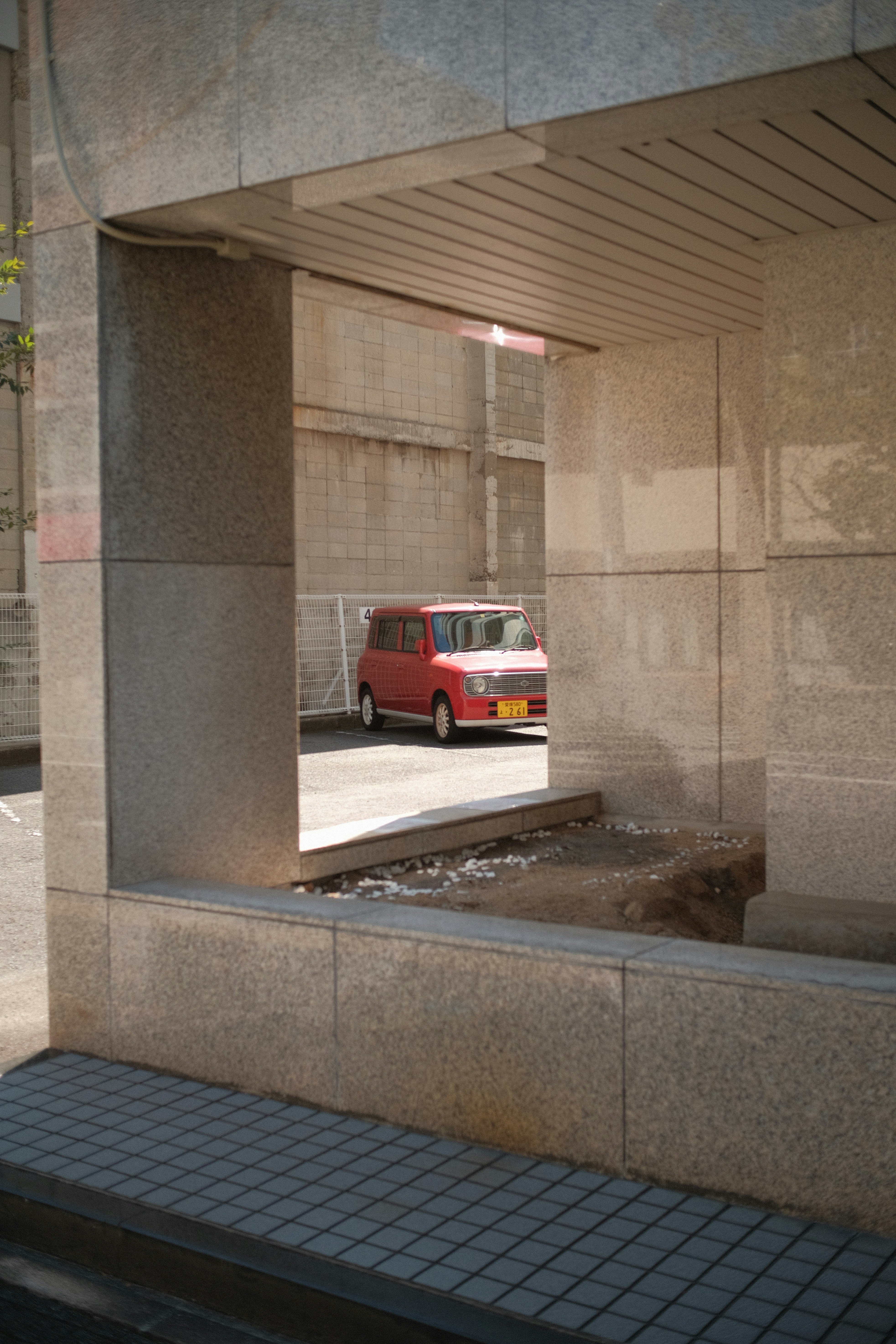 a red van is parked in a parking garage