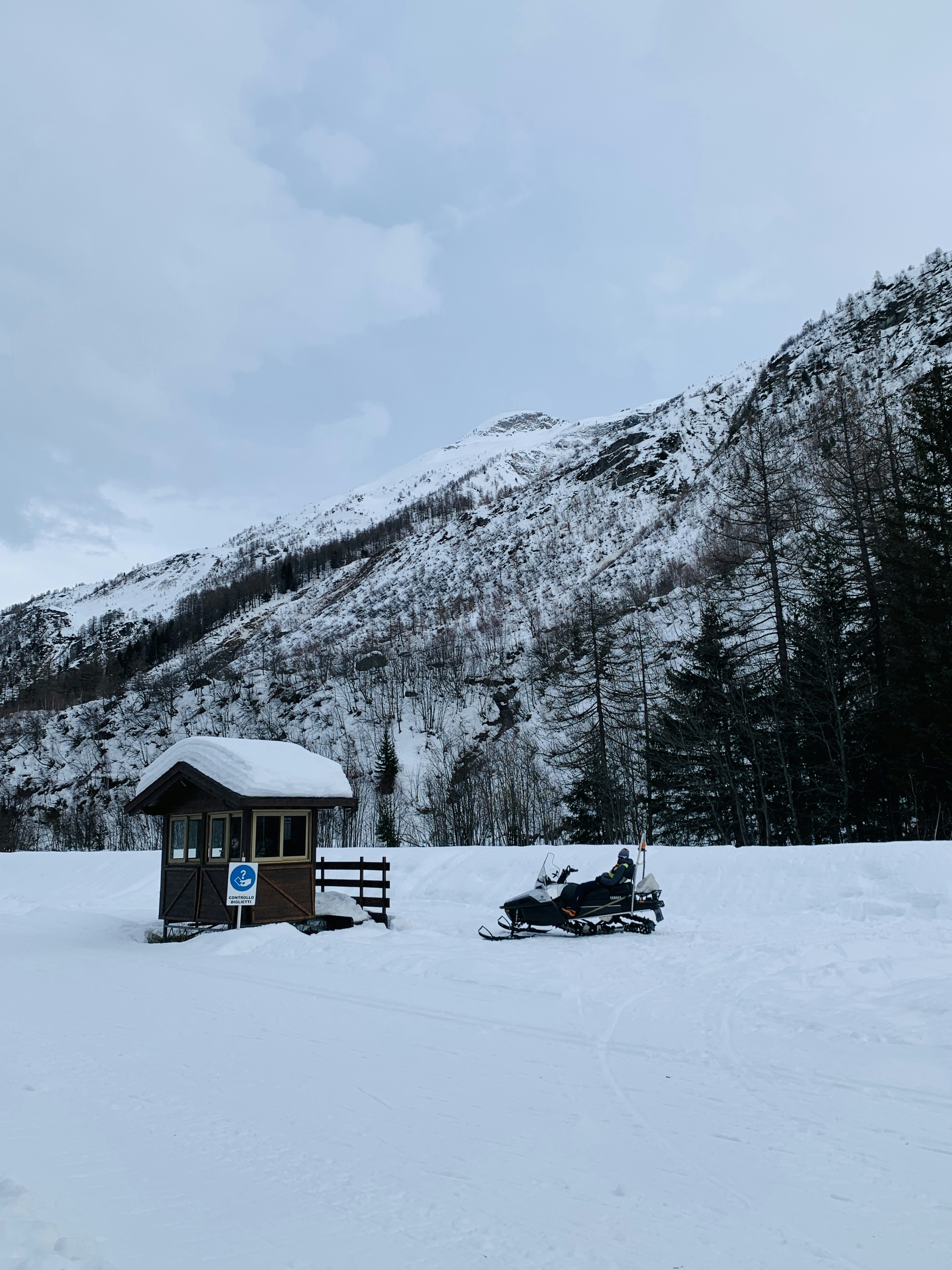 Snowbound Outpost by the Mountain Slopes