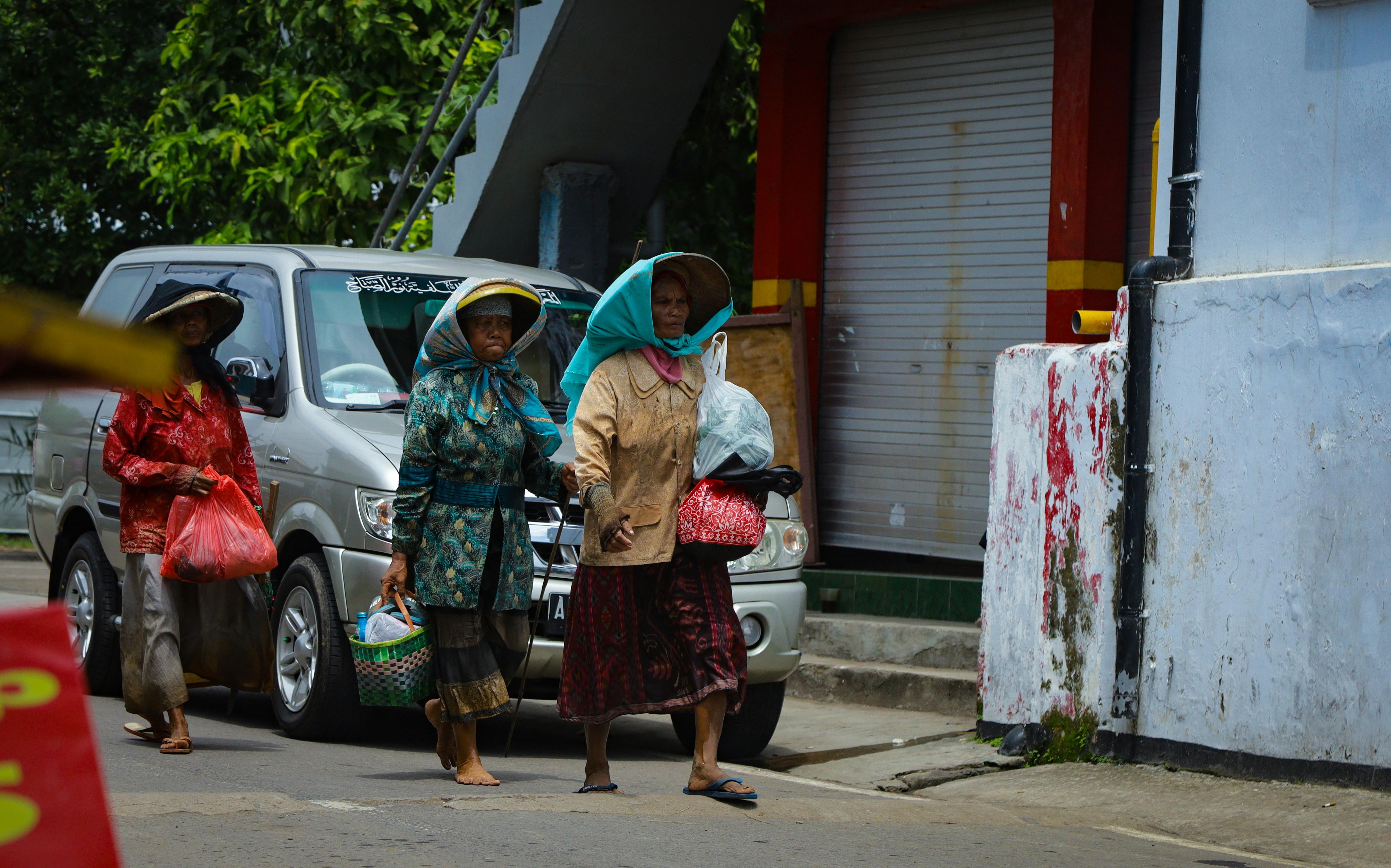 Saffron-cloaked Gatherers on a Quiet Street