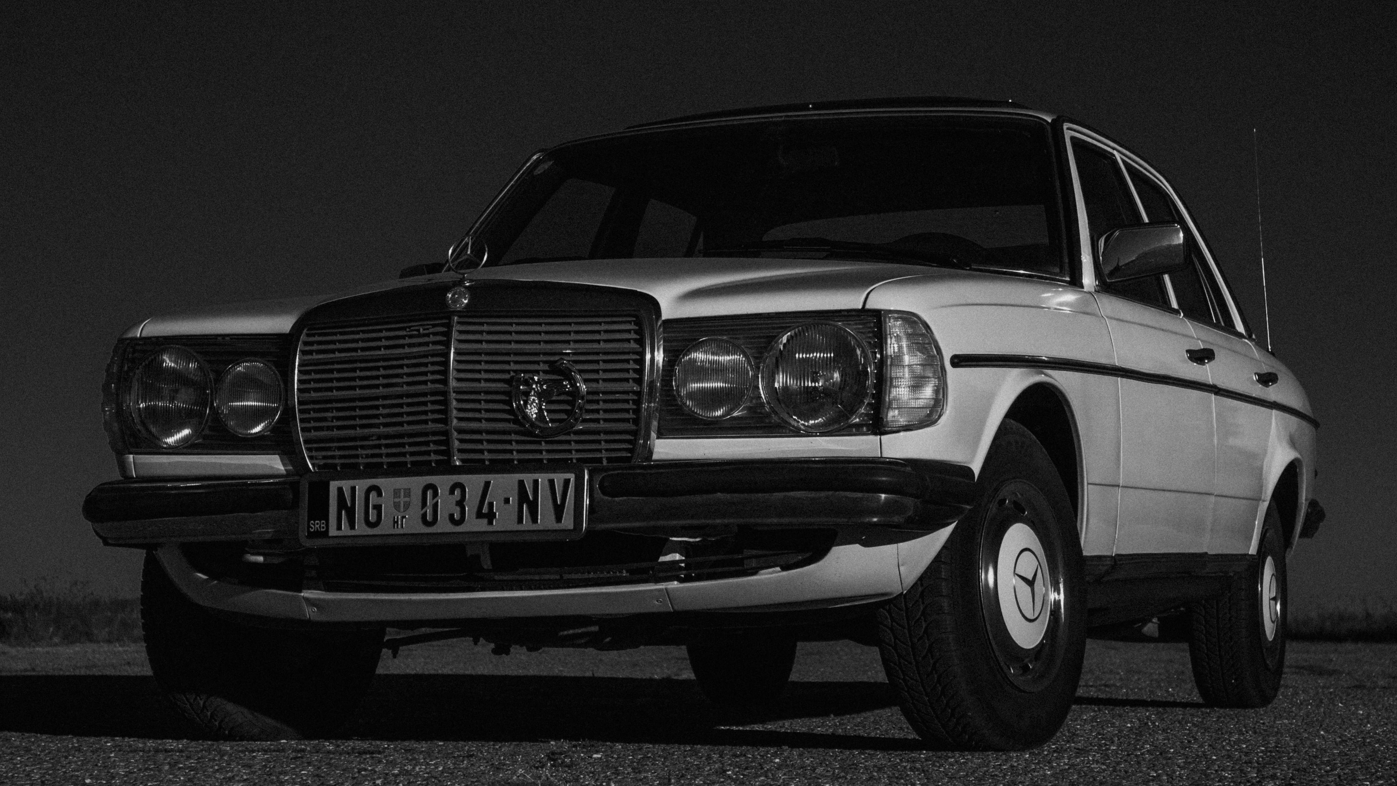 Grayscale Chrome on the Desolate Tarmac: Vintage Mercedes W123 at Rest