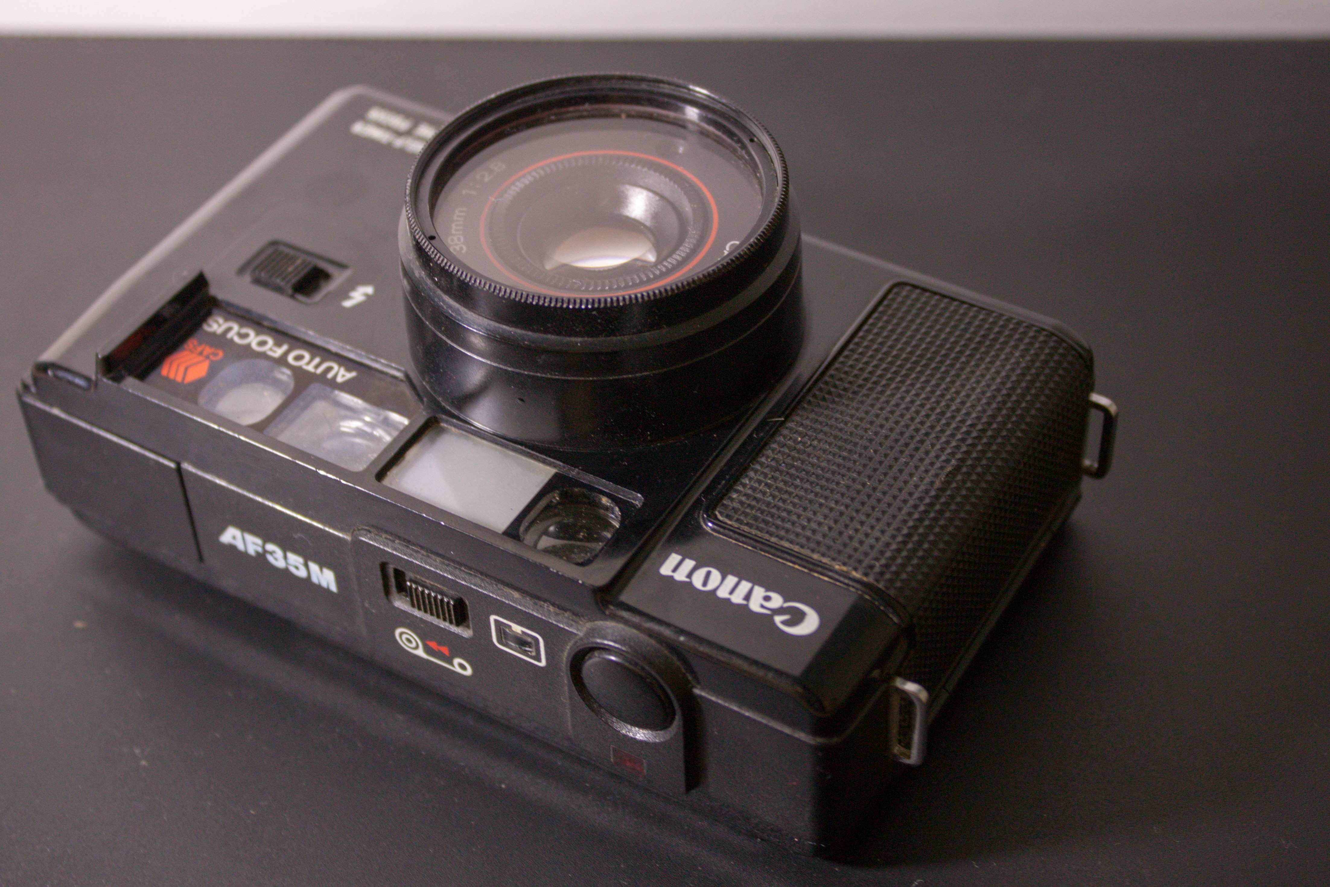 Retro Precision: Canon AF35M Compact in a Minimalist Studio Still