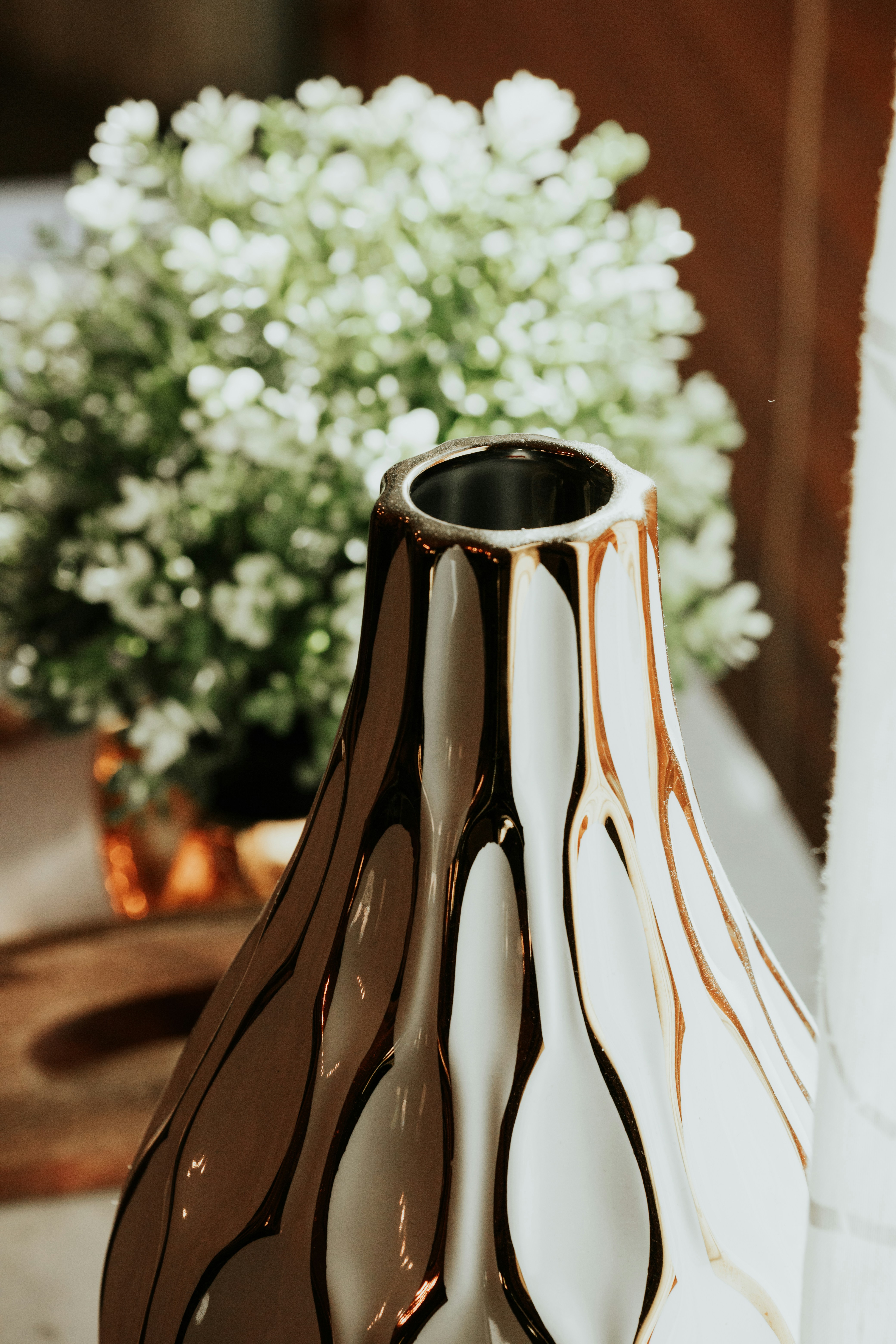 Ceramic Vase in Soft Focus with Floral Backdrop